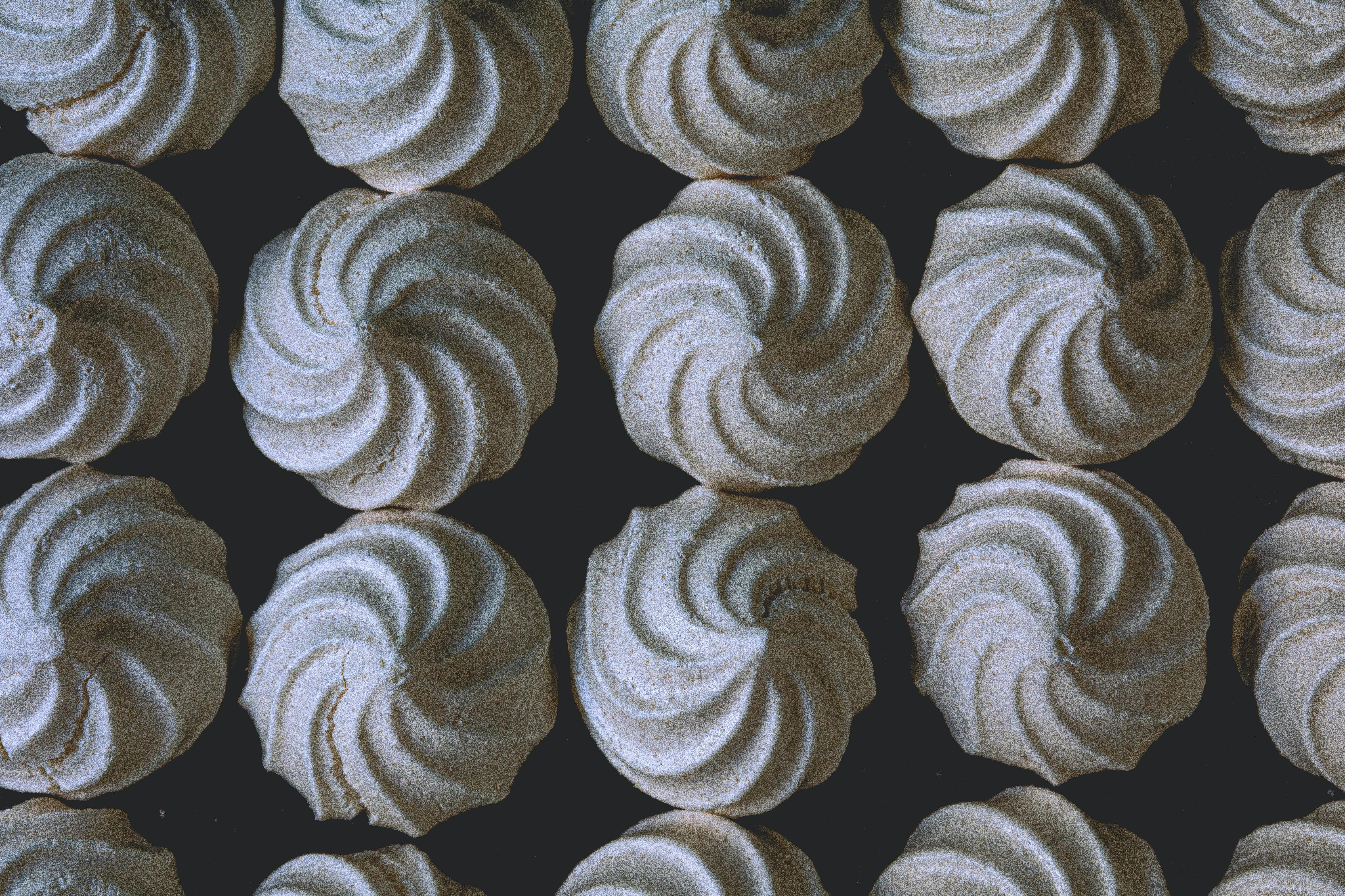 Elegant Meringue Display with Swirl Patterns · Free Stock Photo