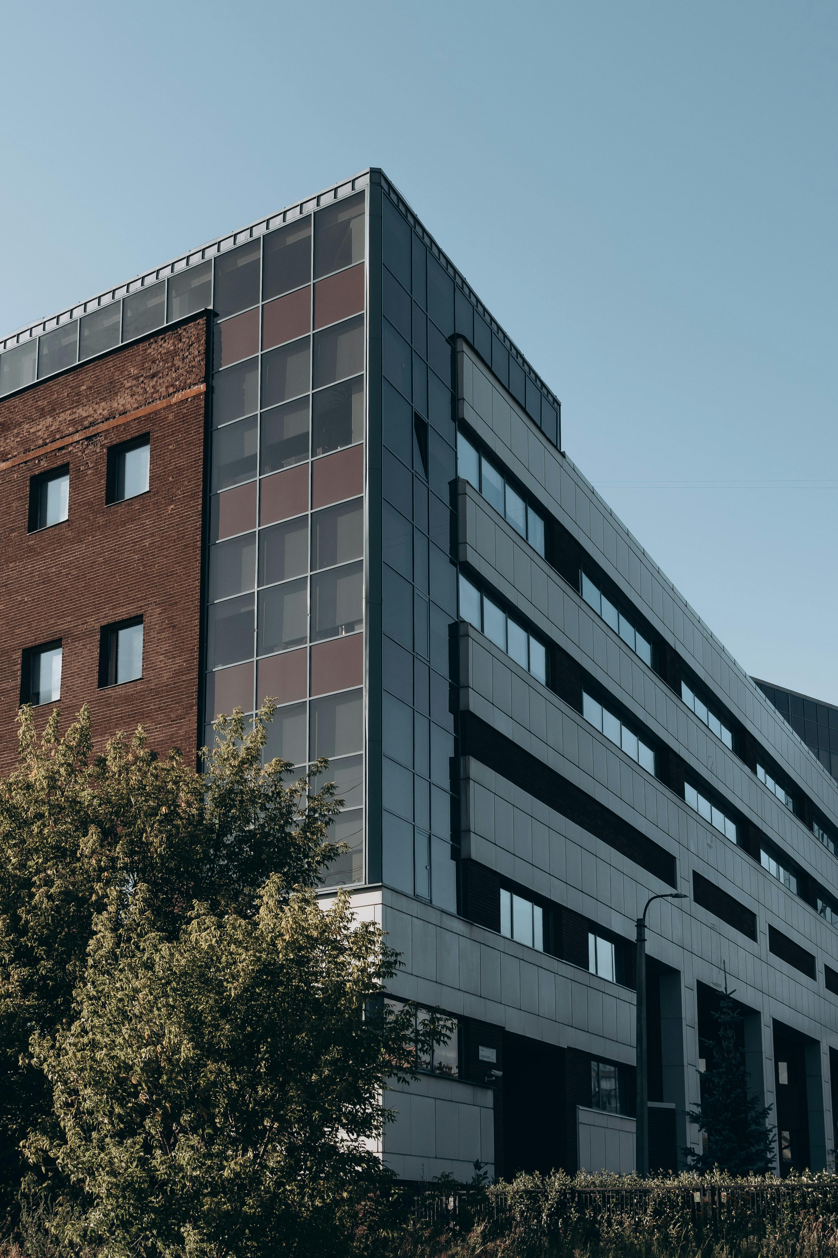 Modern Urban Building with Brick and Metal Facade · Free Stock Photo