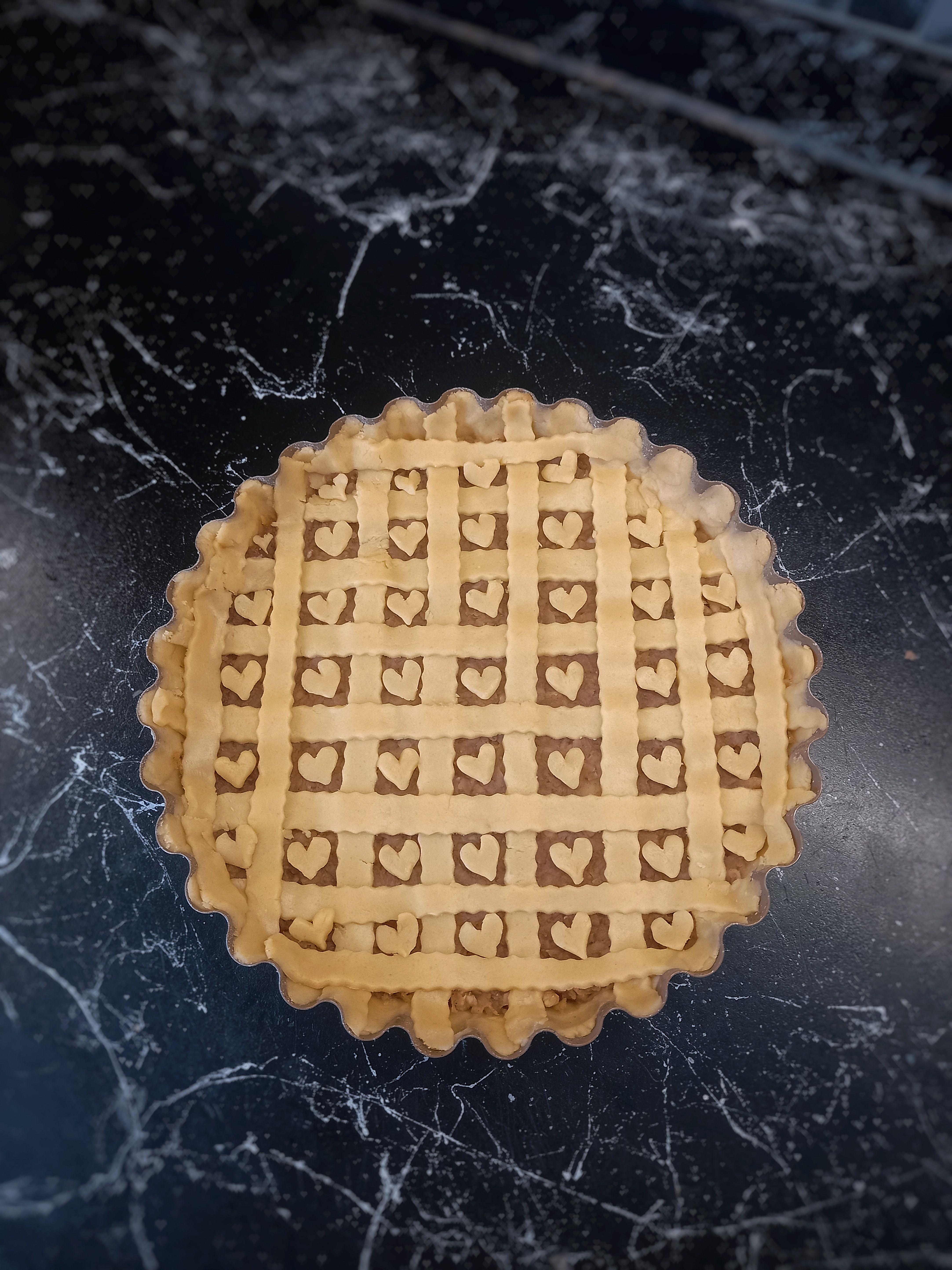 Lattice Heart Pattern Pie on Marble Surface · Free Stock Photo