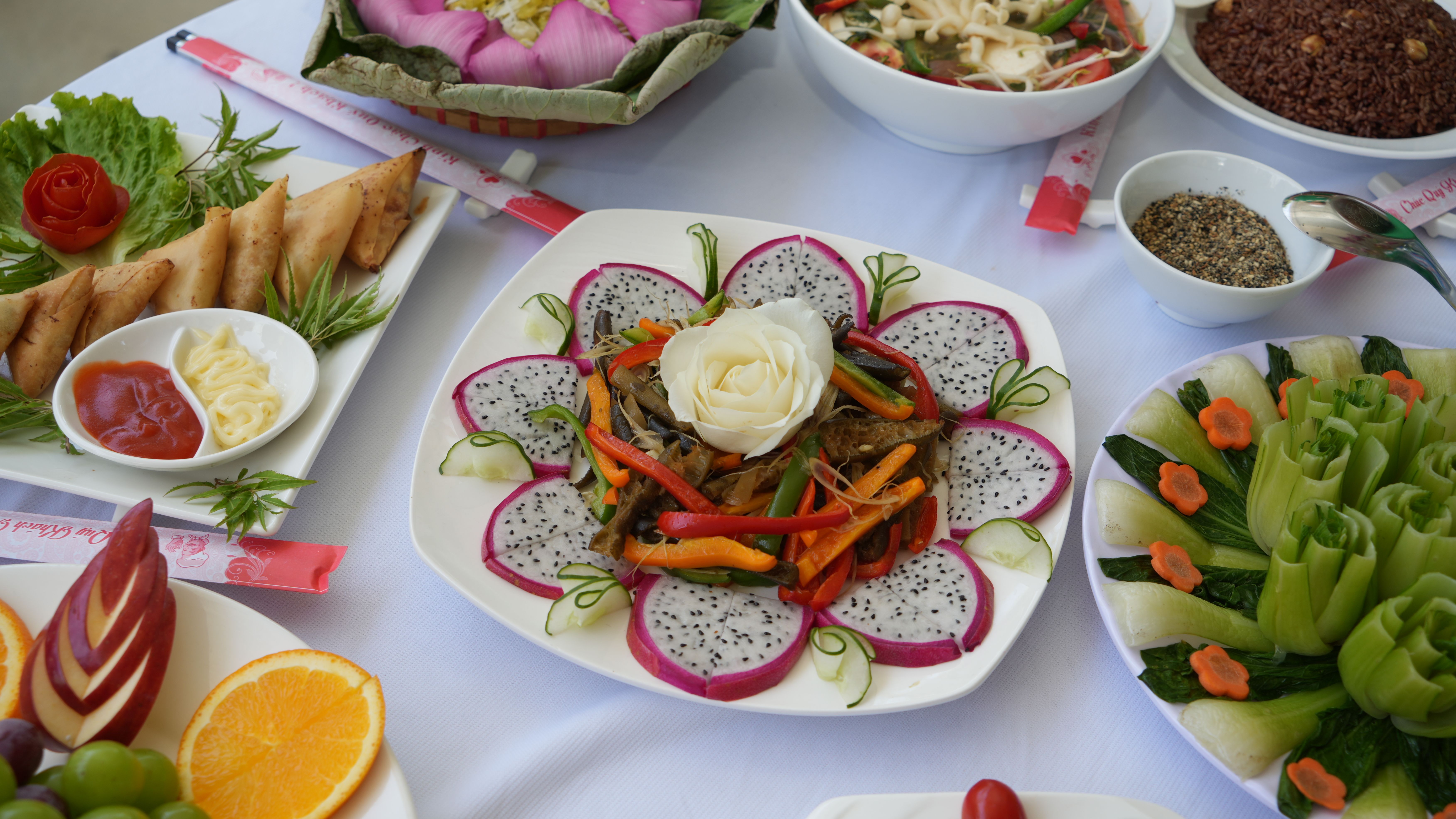 Colorful Asian Cuisine and Fruit Platter Display · Free Stock Photo