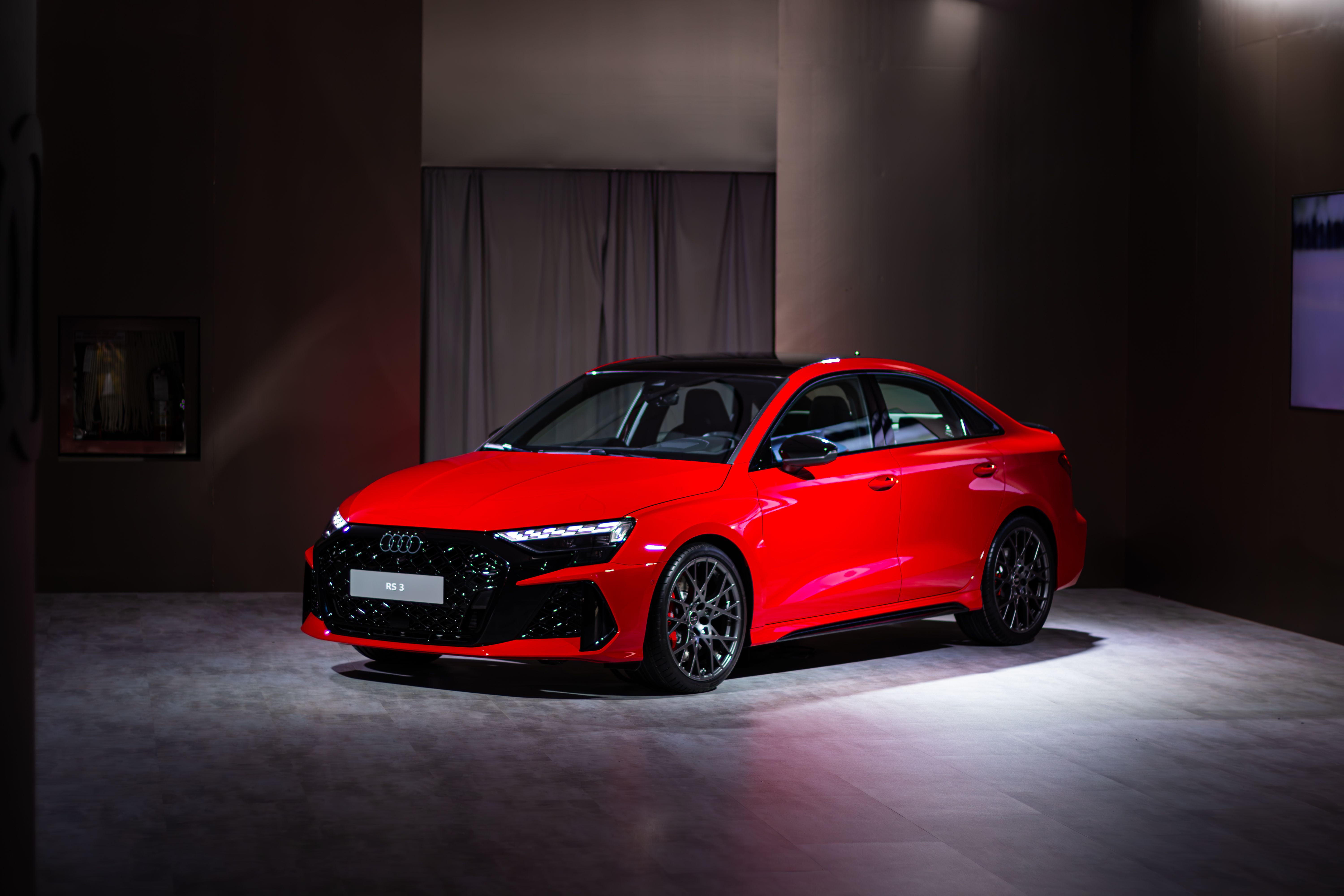 Sleek Red Audi RS Showcased in Toronto Studio · Free Stock Photo