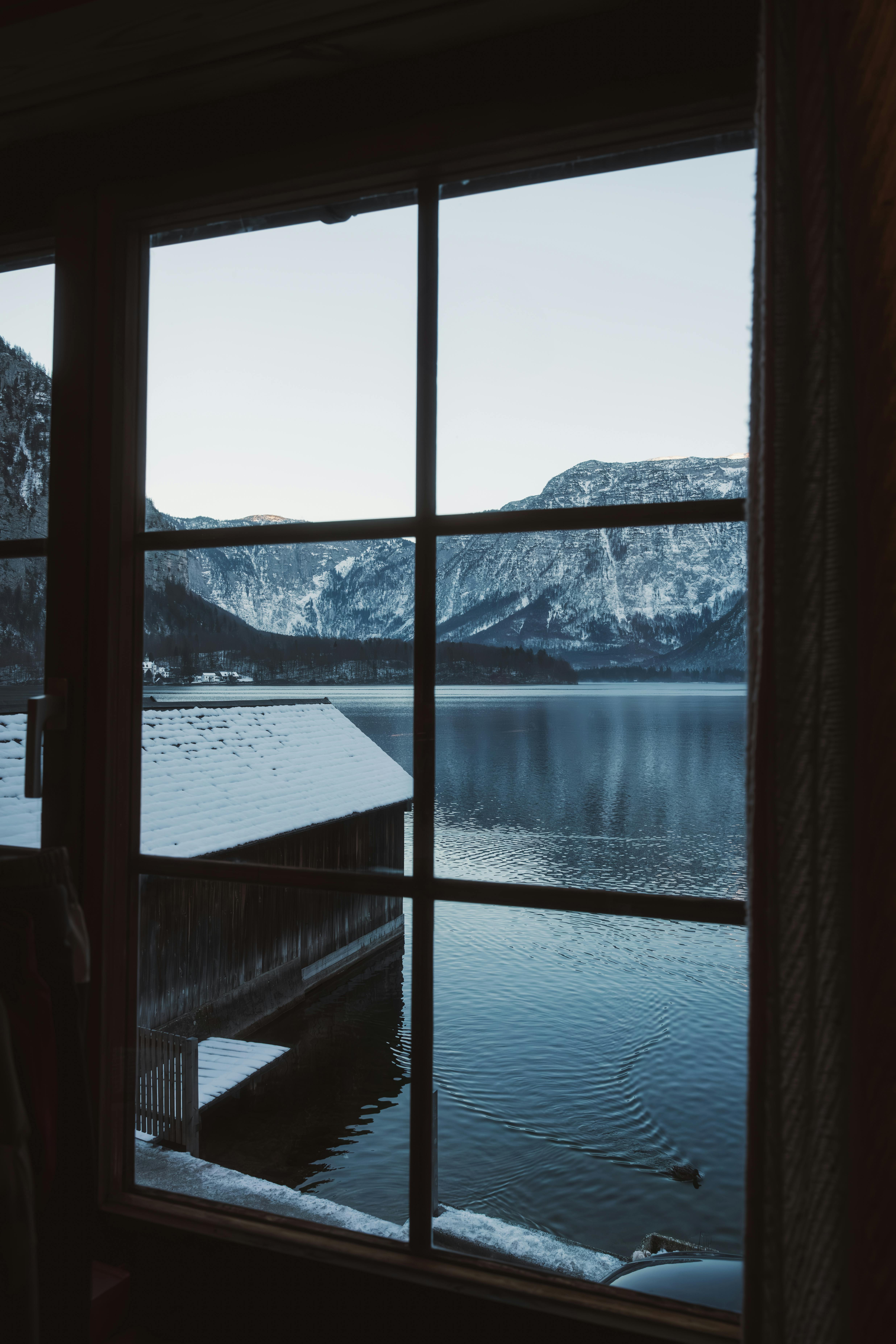 Serene Winter Lake View Through Window · Free Stock Photo