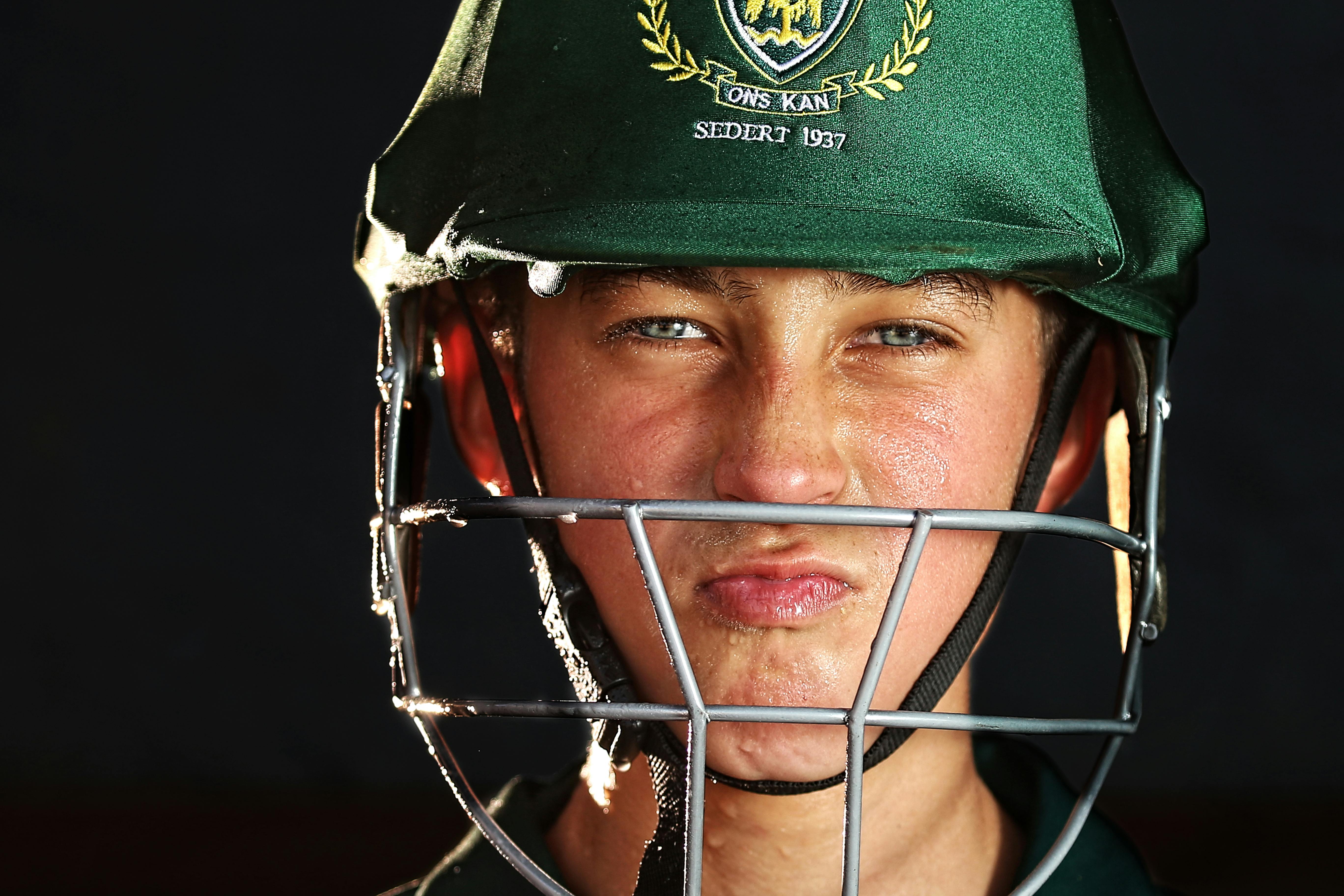 Close-up of Young Cricketer in Helmet · Free Stock Photo
