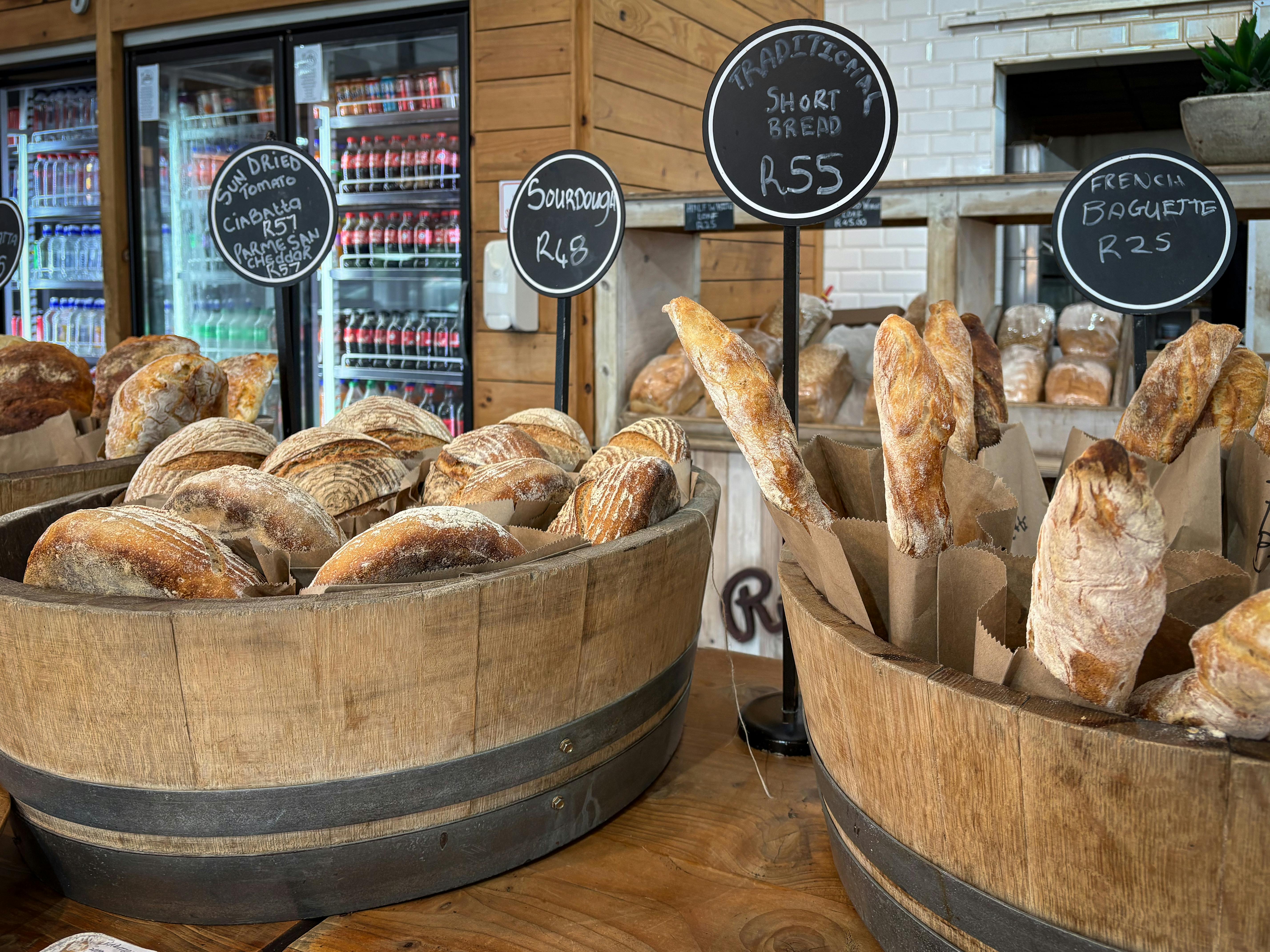 Rustic Bakery Display with Various Bread Assortments · Free Stock Photo