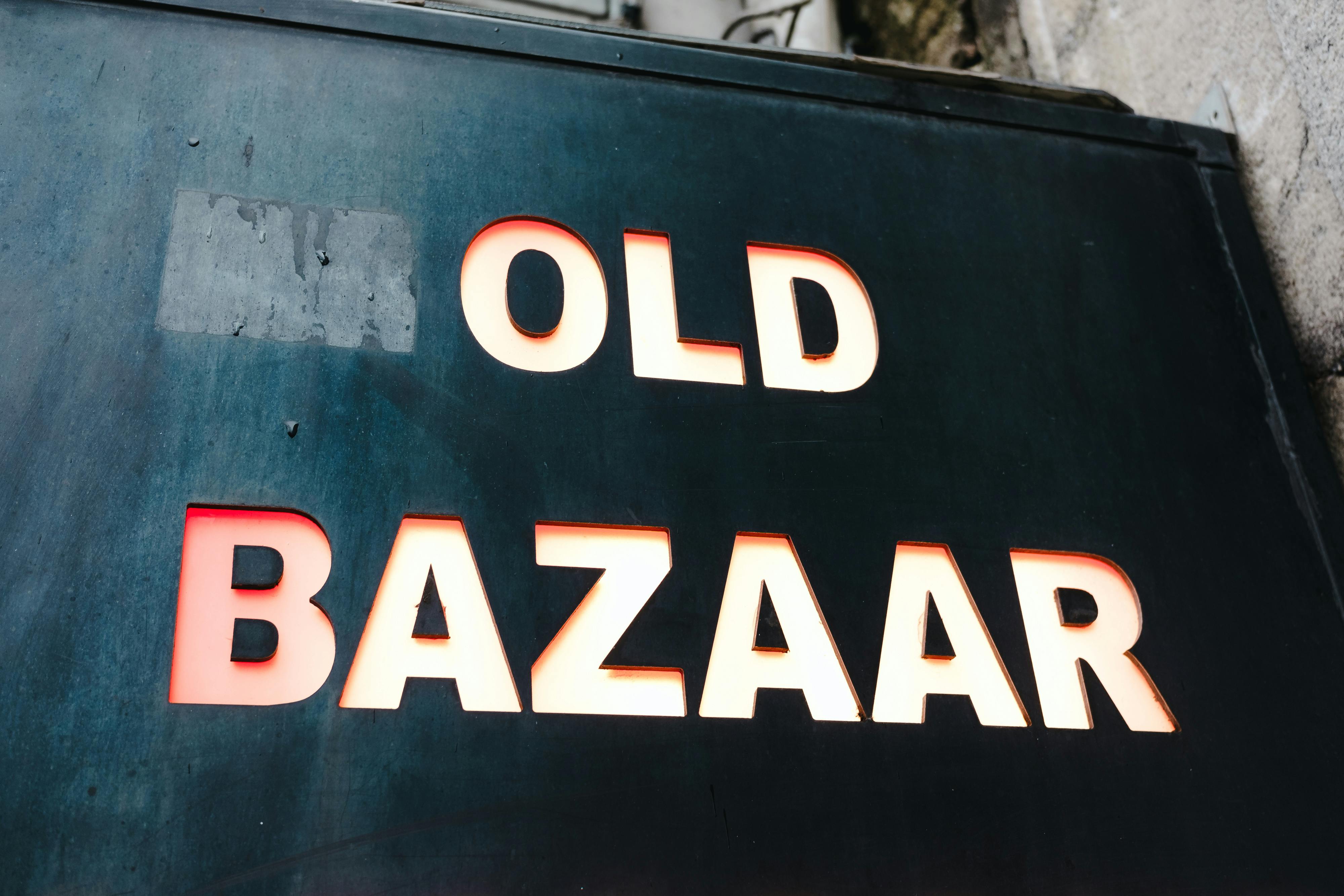 Vintage Old Bazaar Sign in Urban Setting · Free Stock Photo