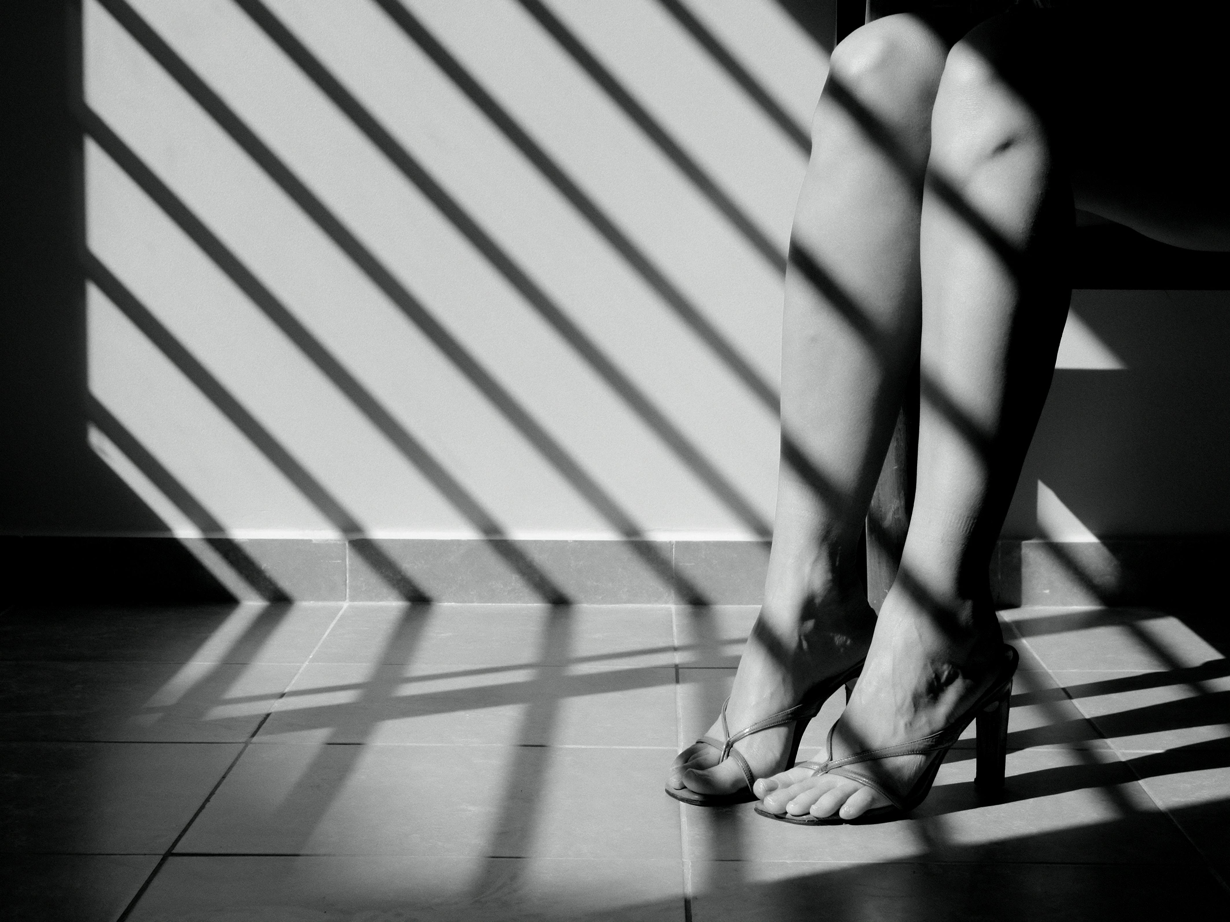 Artistic Shadow Patterns on Legs with High Heels · Free Stock Photo