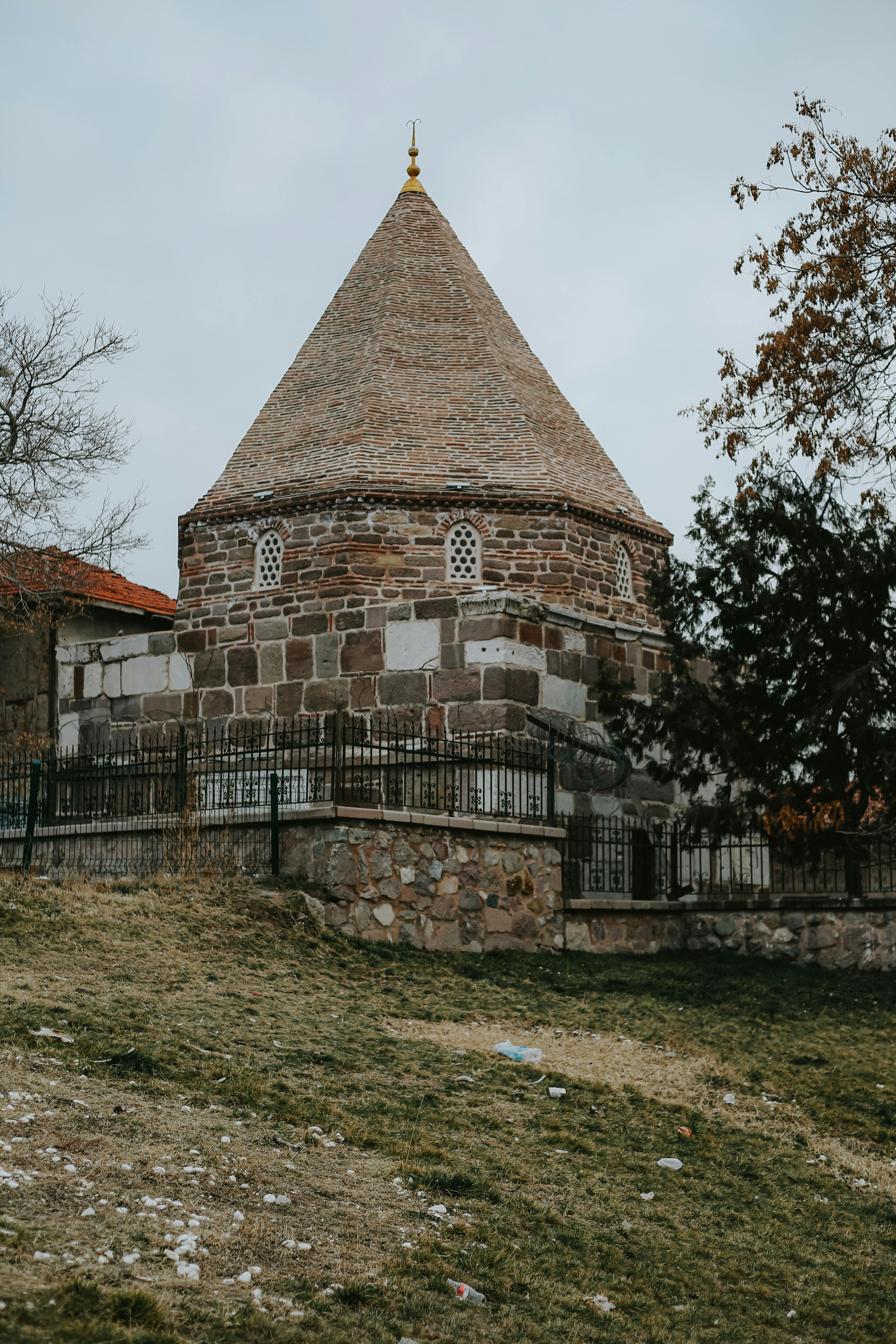 Historic Stone Structure with Conical Roof · Free Stock Photo