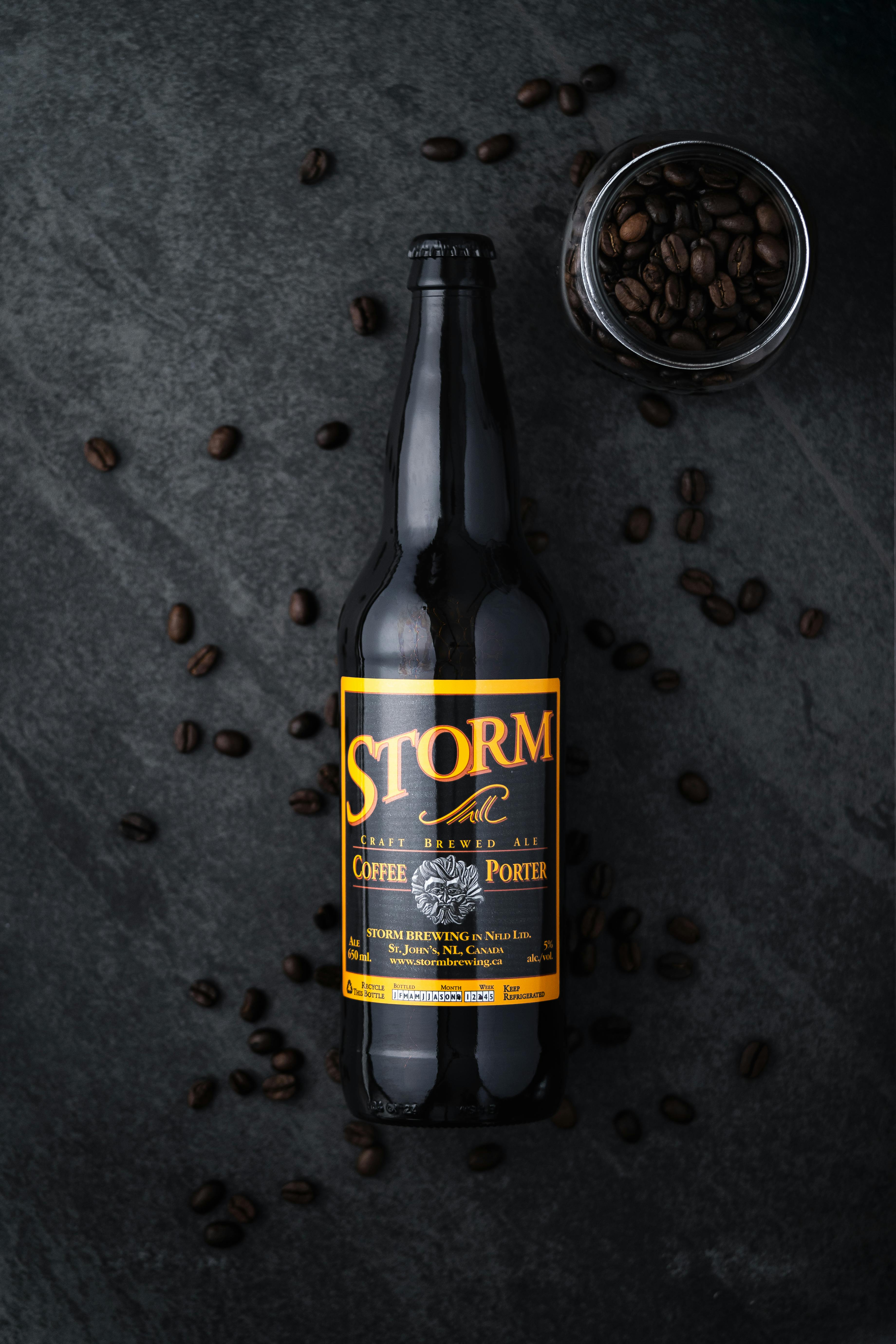 Craft Coffee Porter Beer Bottle with Coffee Beans · Free Stock Photo