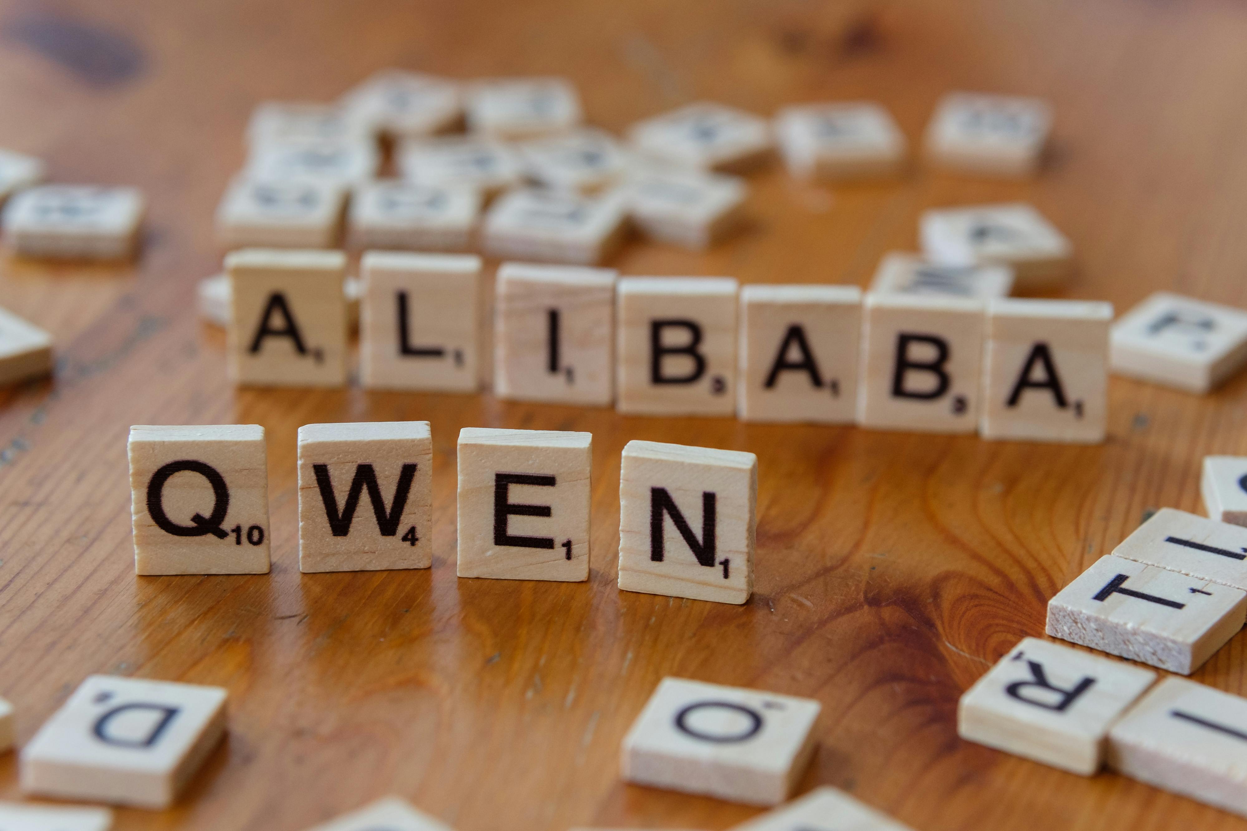 Scrabble Tiles with 'Alibaba' and 'Qwen' · Free Stock Photo