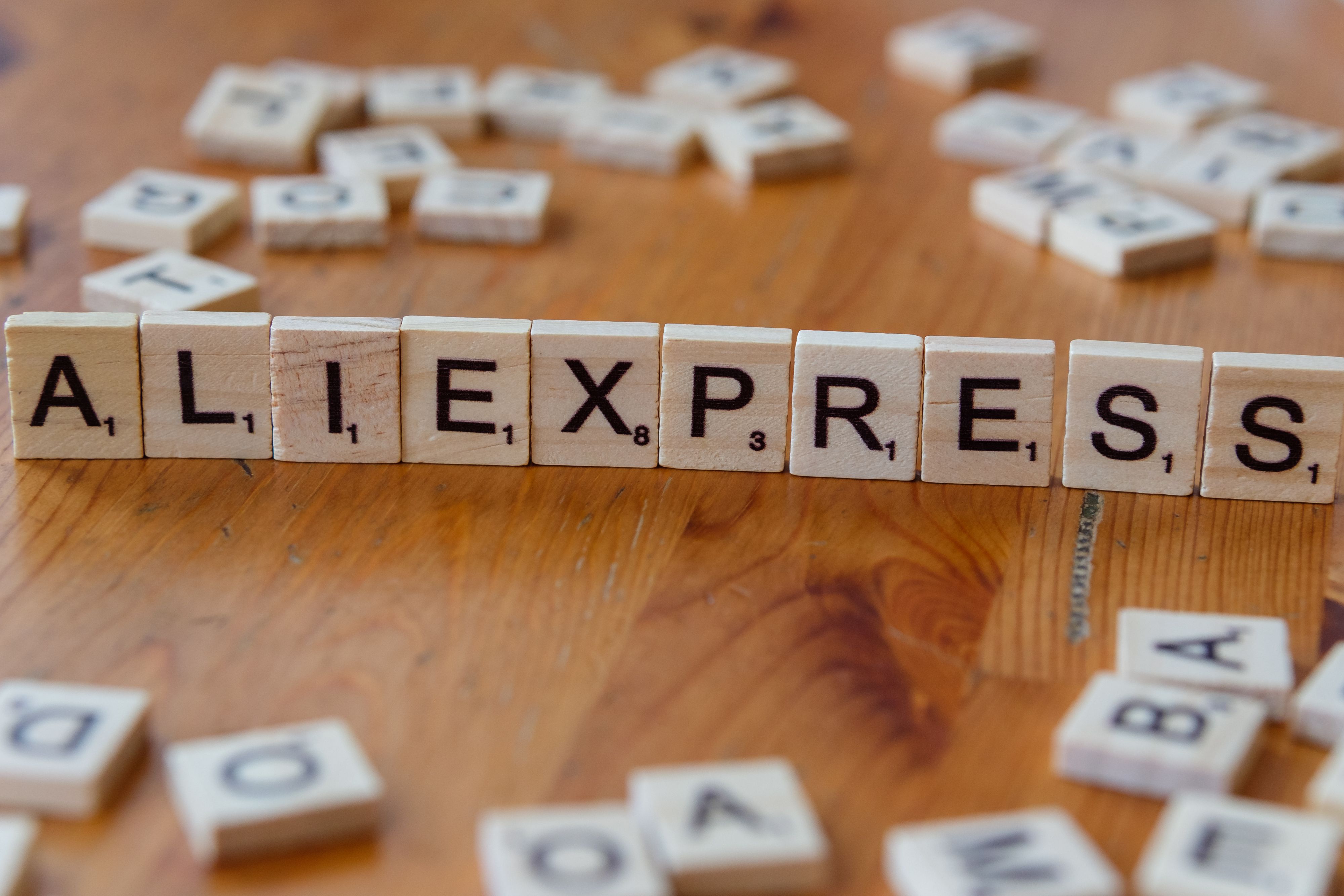 Scrabble Tiles Spelling AliExpress on Wooden Table · Free Stock Photo