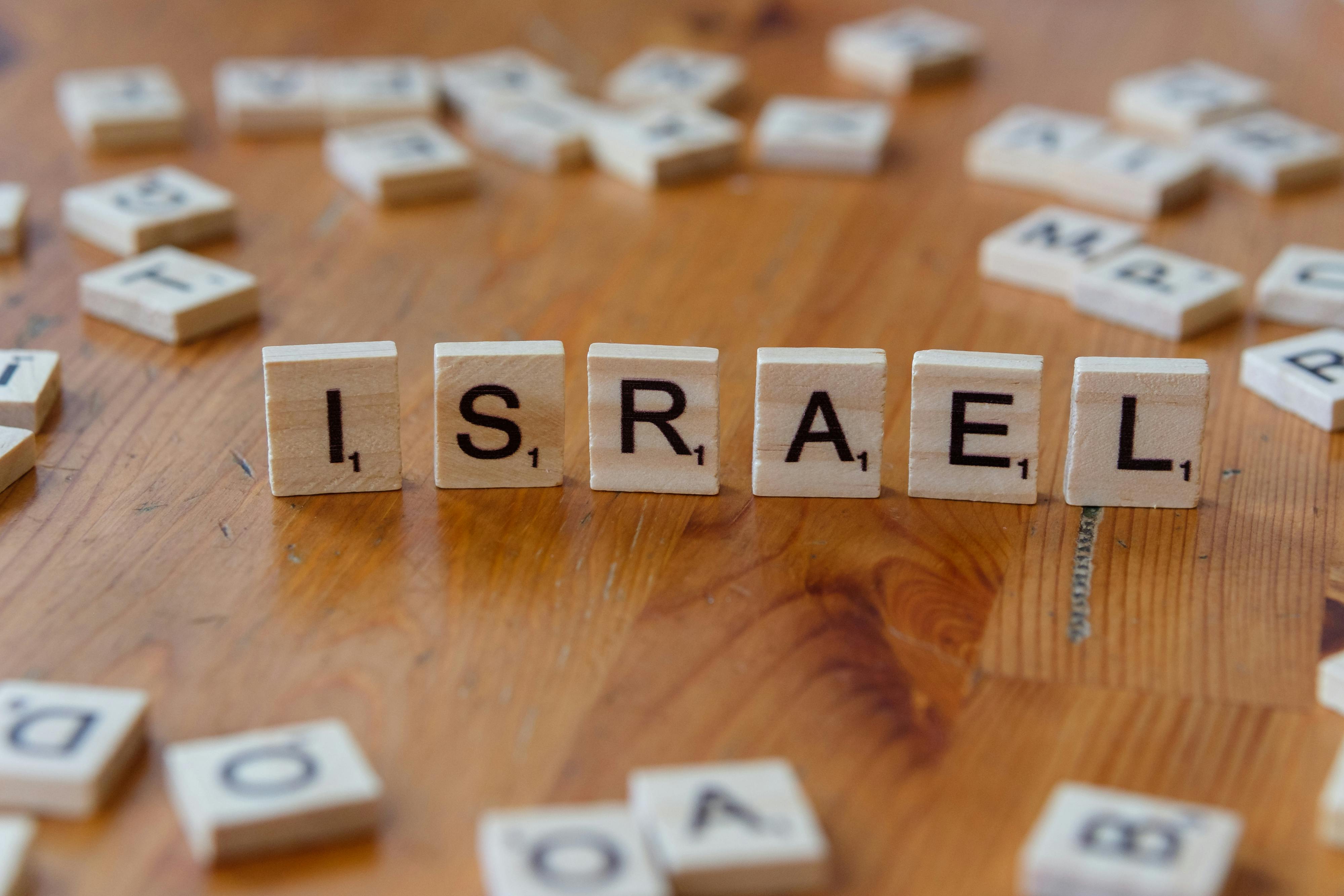 Scrabble Tiles Spelling 'Israel' on a Table · Free Stock Photo