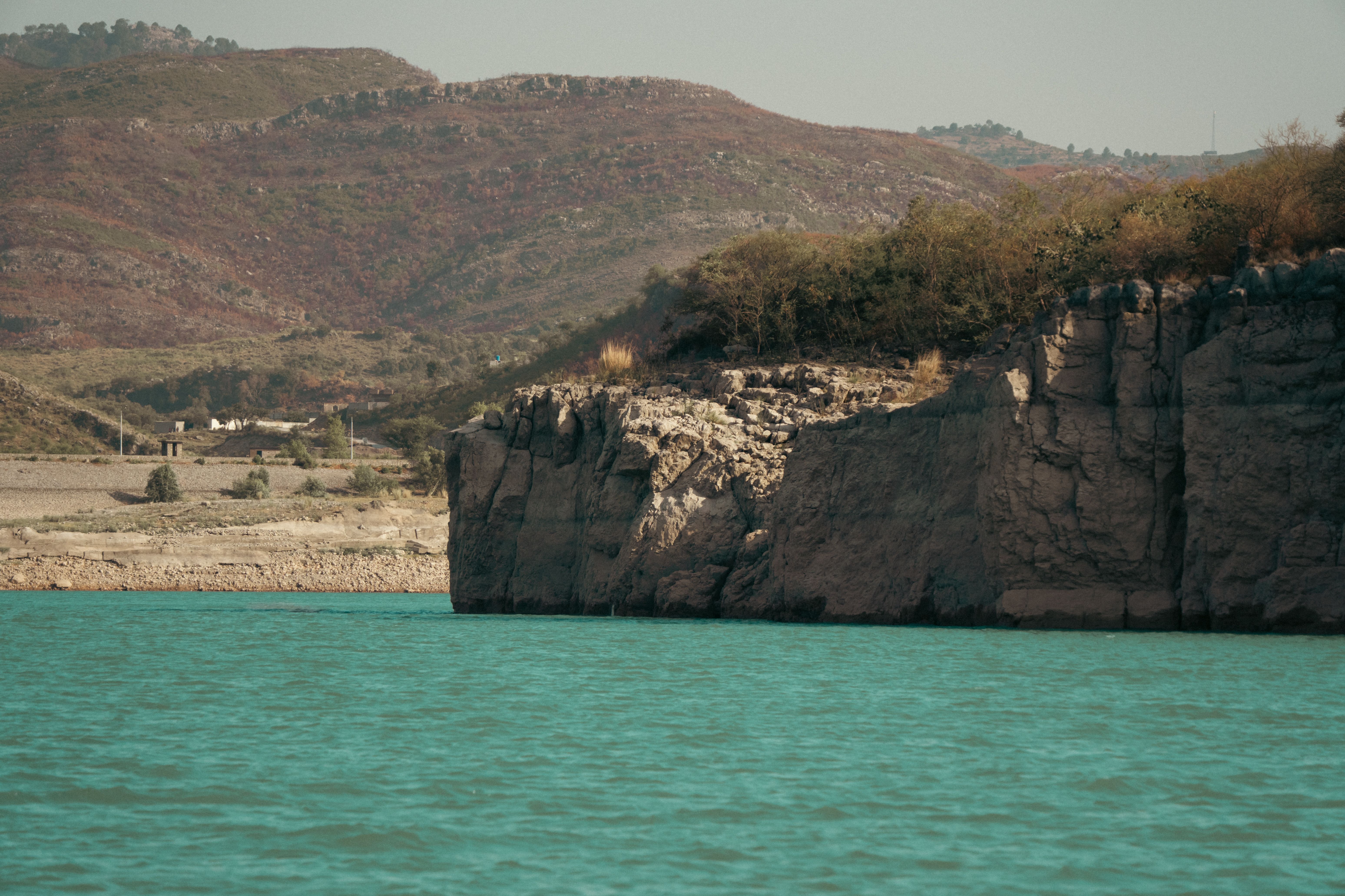 Serene Lake and Rocky Cliffs in Summer · Free Stock Photo