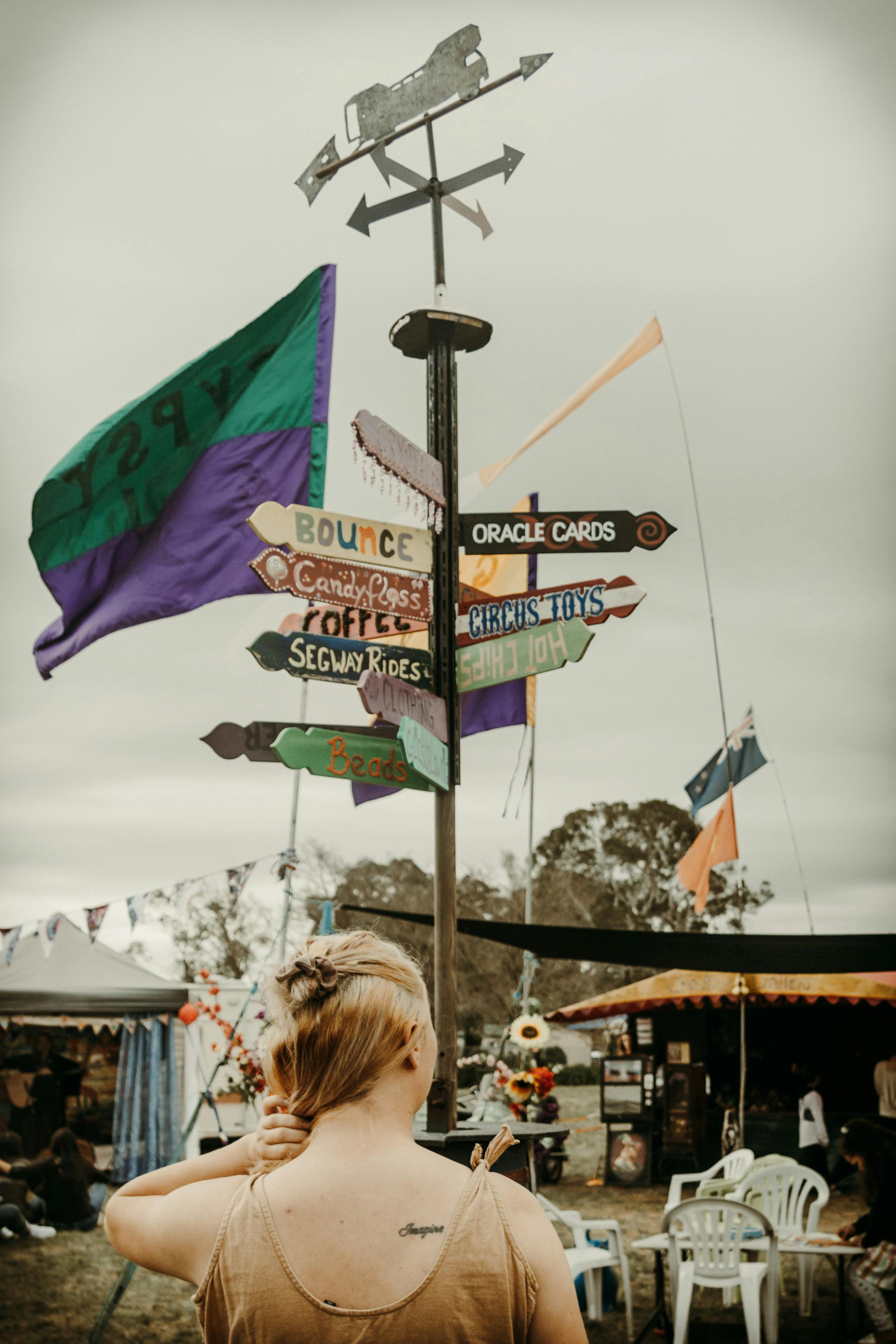 Woman Standing Near Post · Free Stock Photo