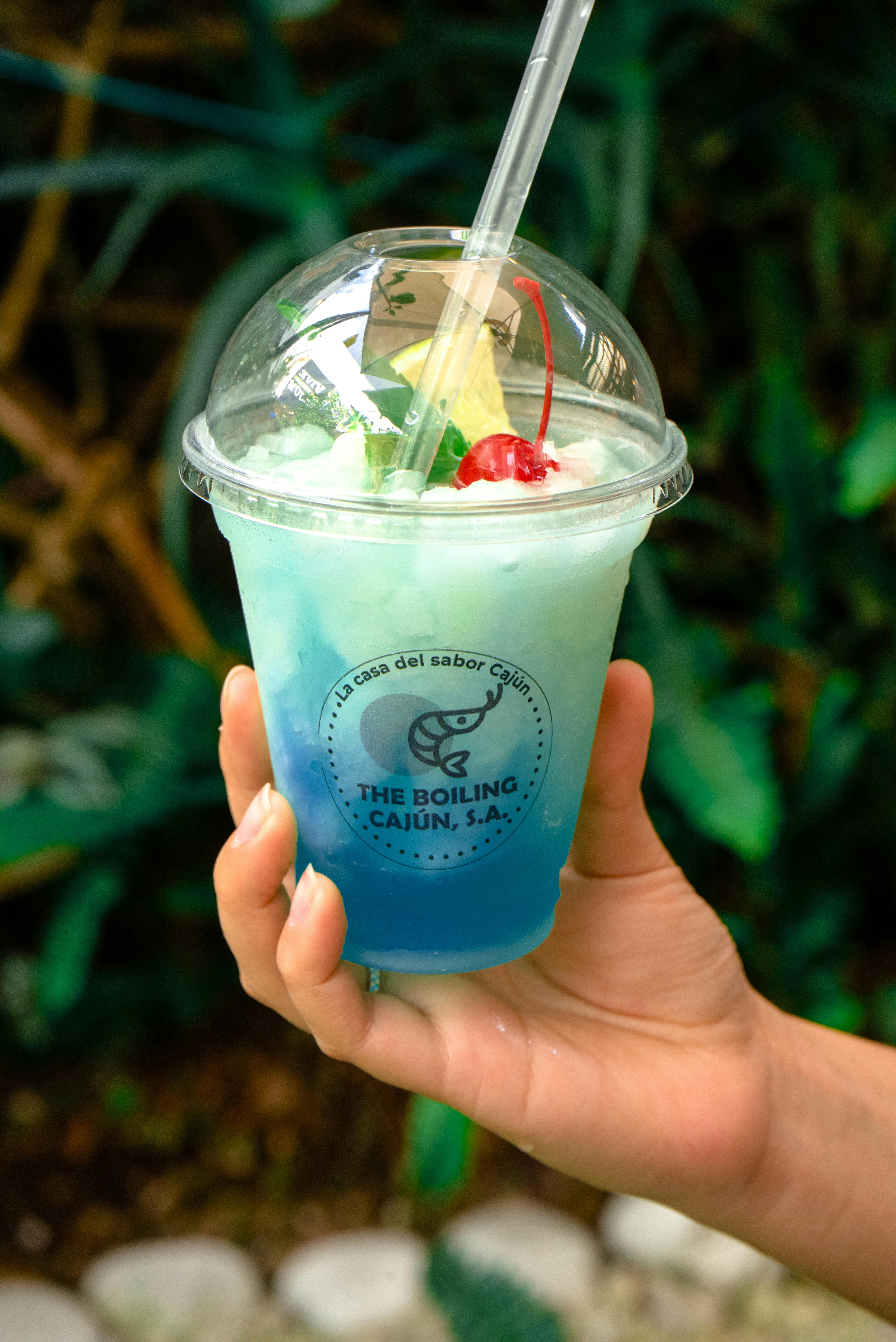 Refreshing Blue Tropical Beverage in To-Go Cup · Free Stock Photo