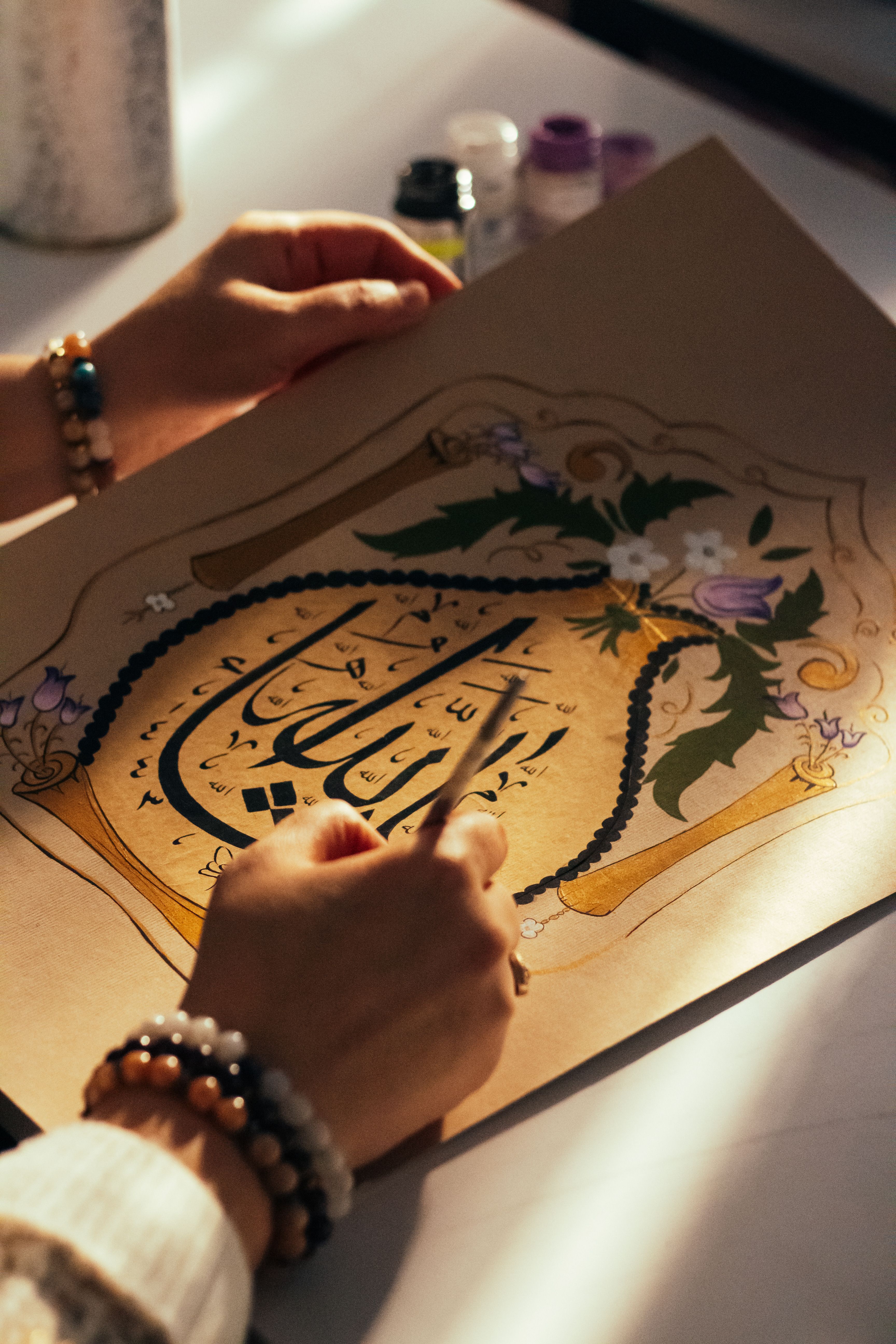 Artistic Calligraphy with Beads and Florals · Free Stock Photo