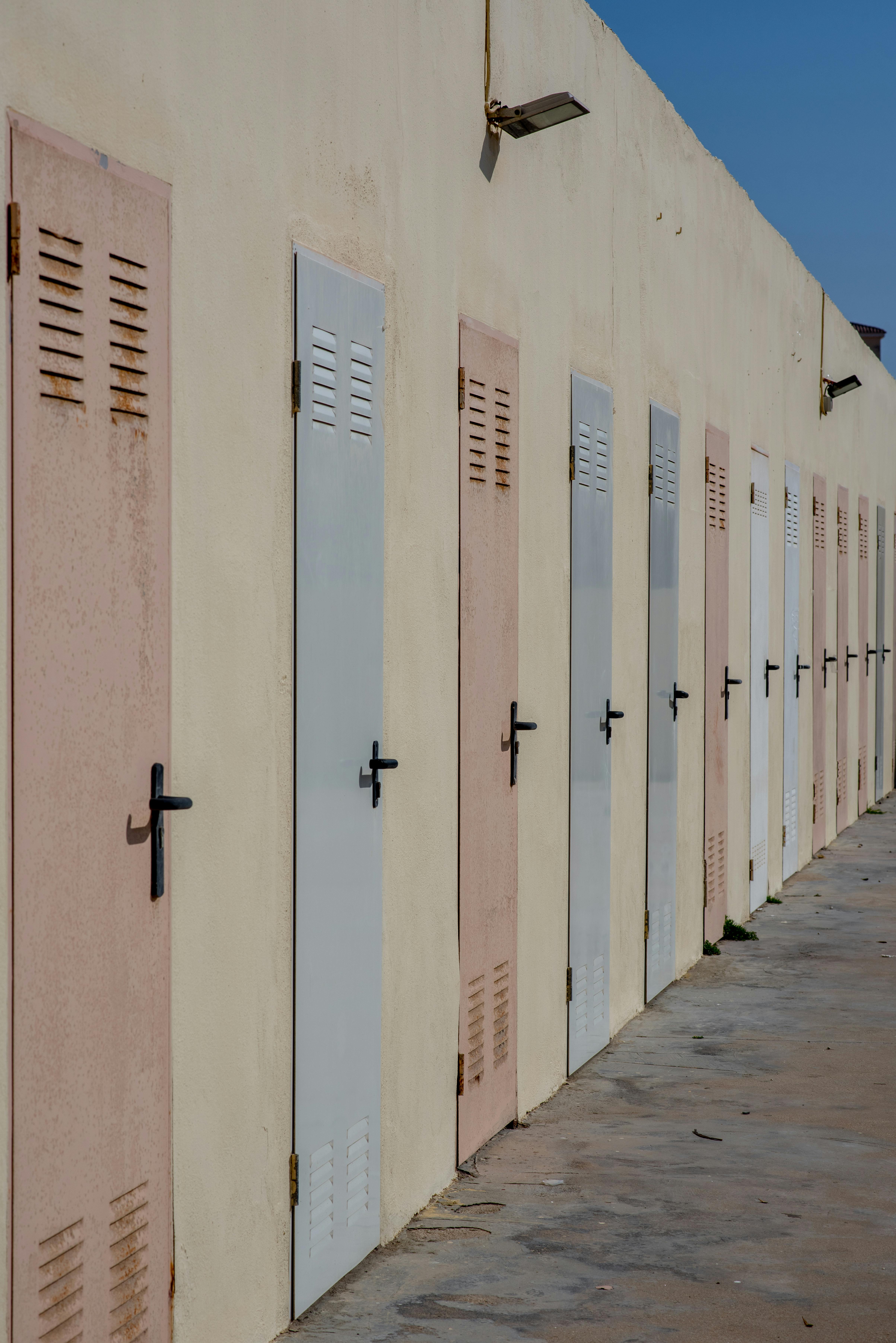 Row of Colorful Beach Changing Room Doors · Free Stock Photo