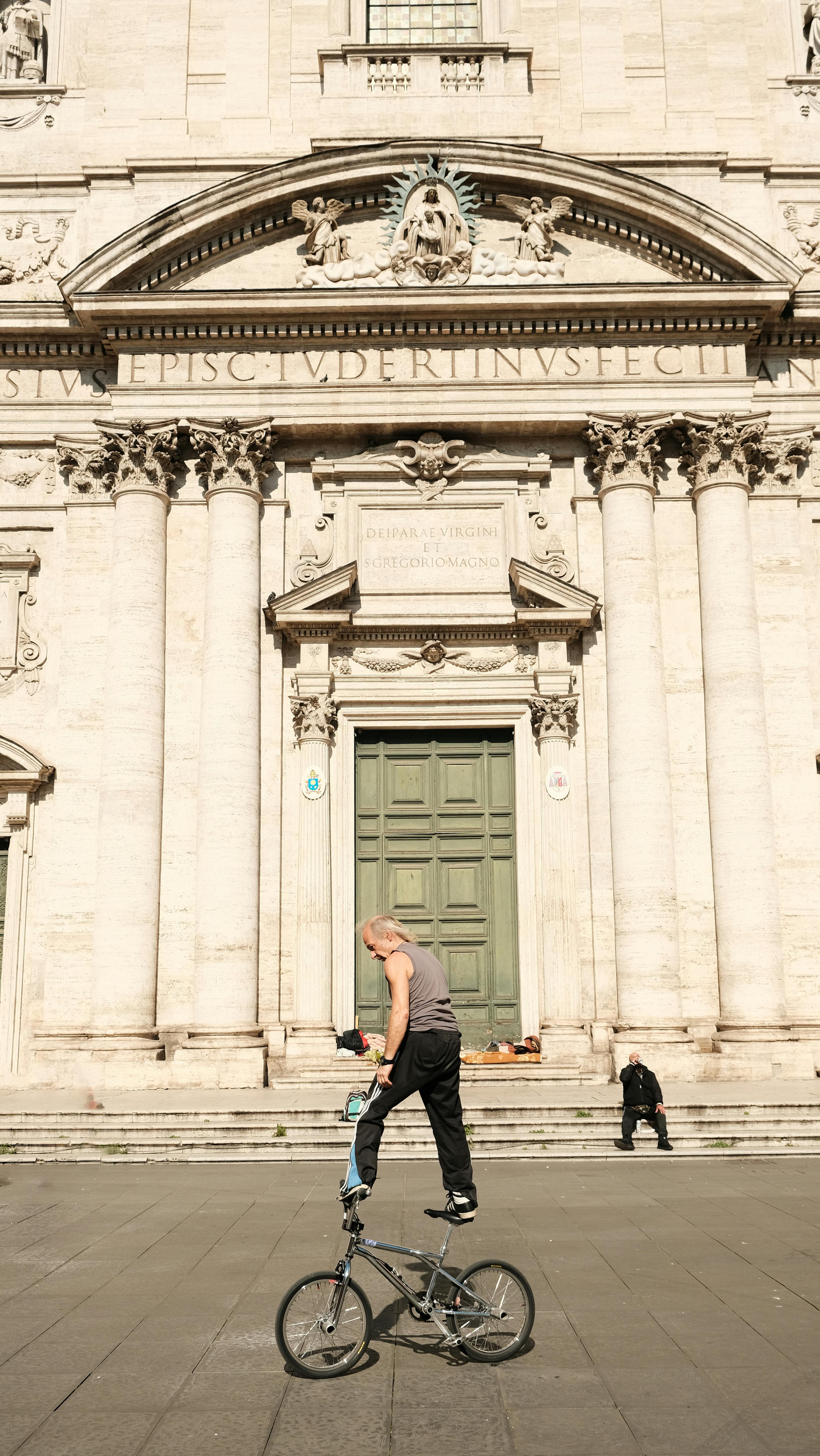 BMX Stunt Rider in Front of Historic Building · Free Stock Photo