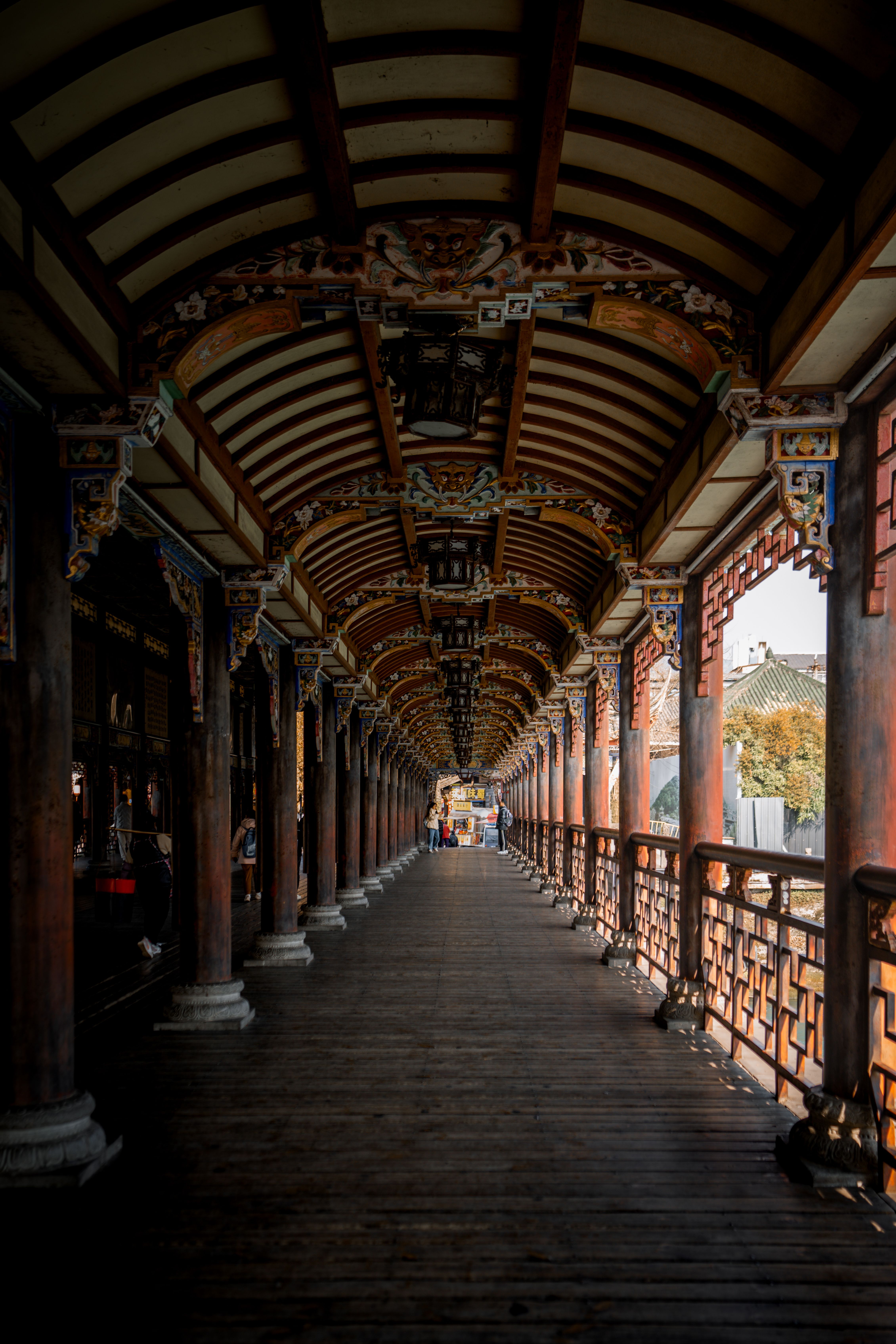 Traditional Wooden Corridor with Ornate Architecture · Free Stock Photo
