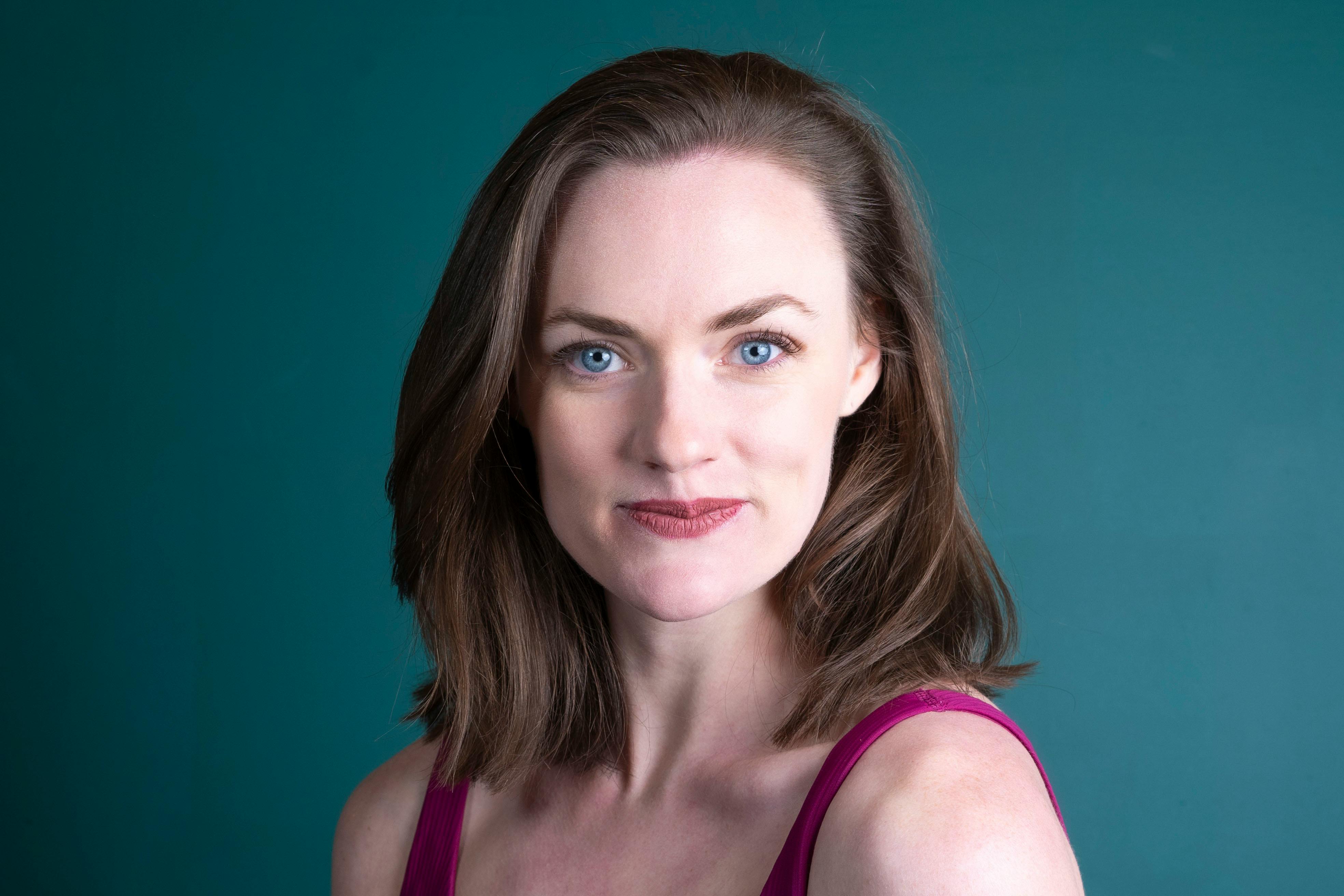 Professional Woman Portrait against Green Background · Free Stock Photo