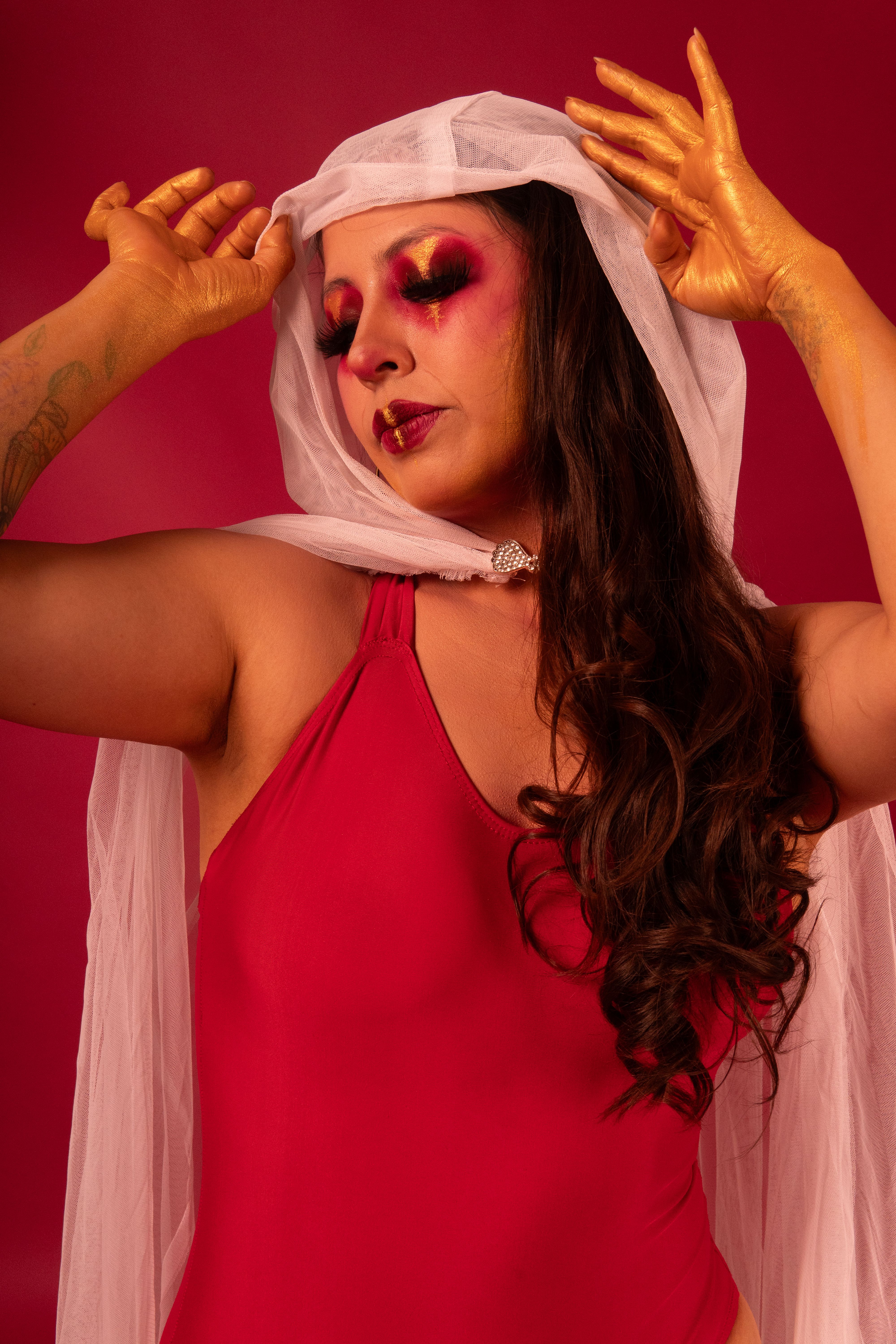 Elegant Latina Woman in Red Dress with Dramatic Makeup · Free Stock Photo