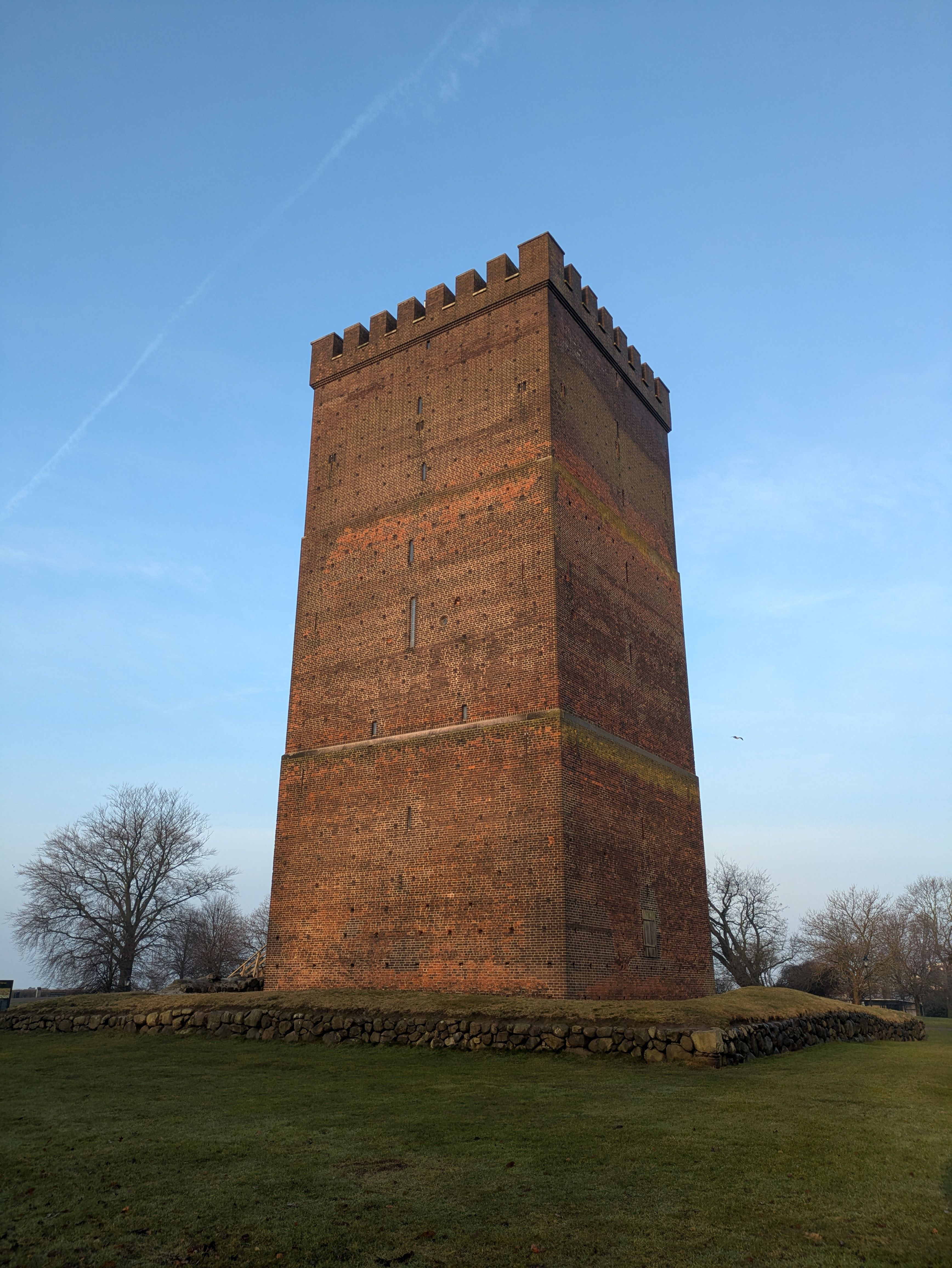 Historic Brick Tower under Clear Blue Sky · Free Stock Photo