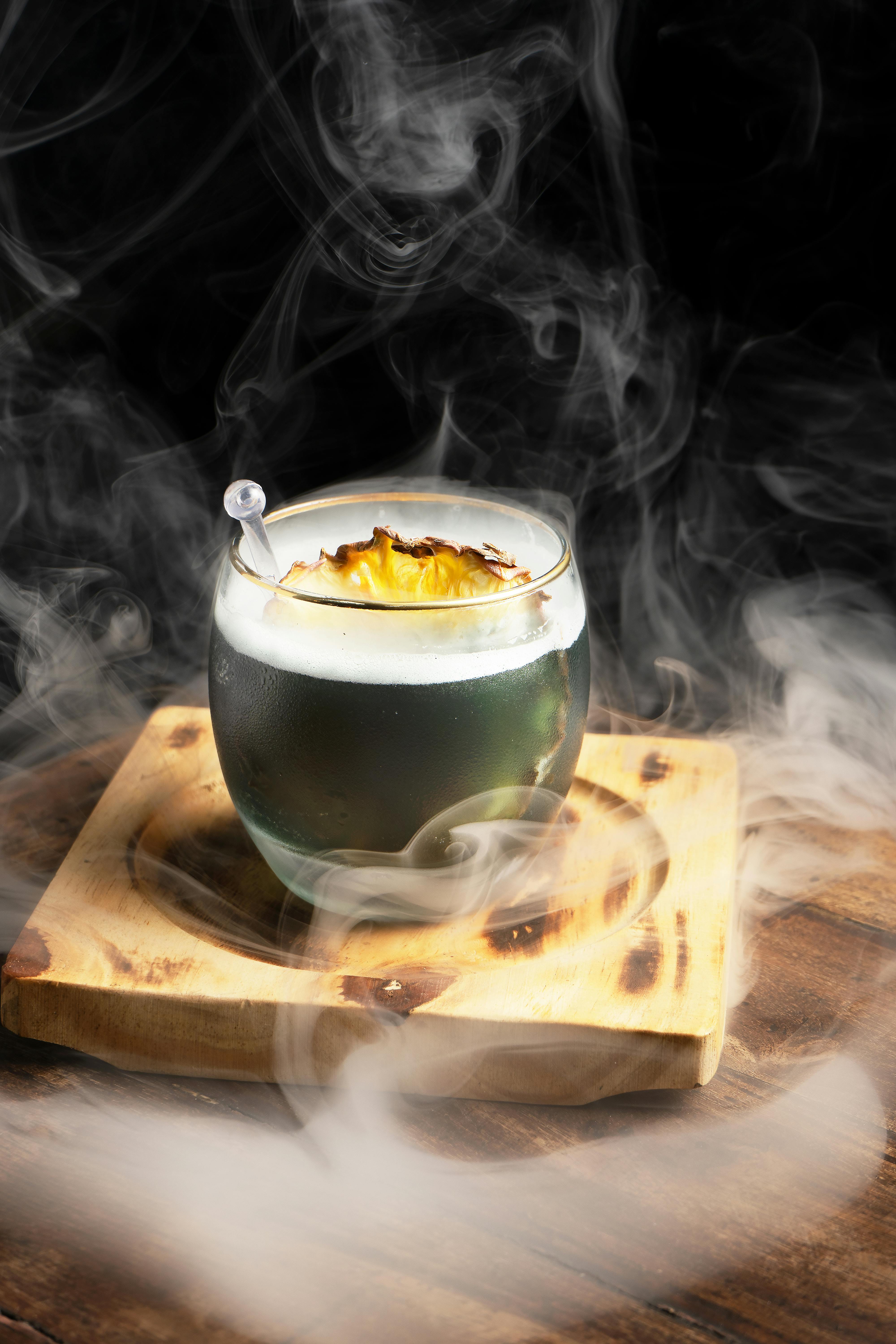Artistic Smoke-Covered Cocktail on Wooden Stand · Free Stock Photo