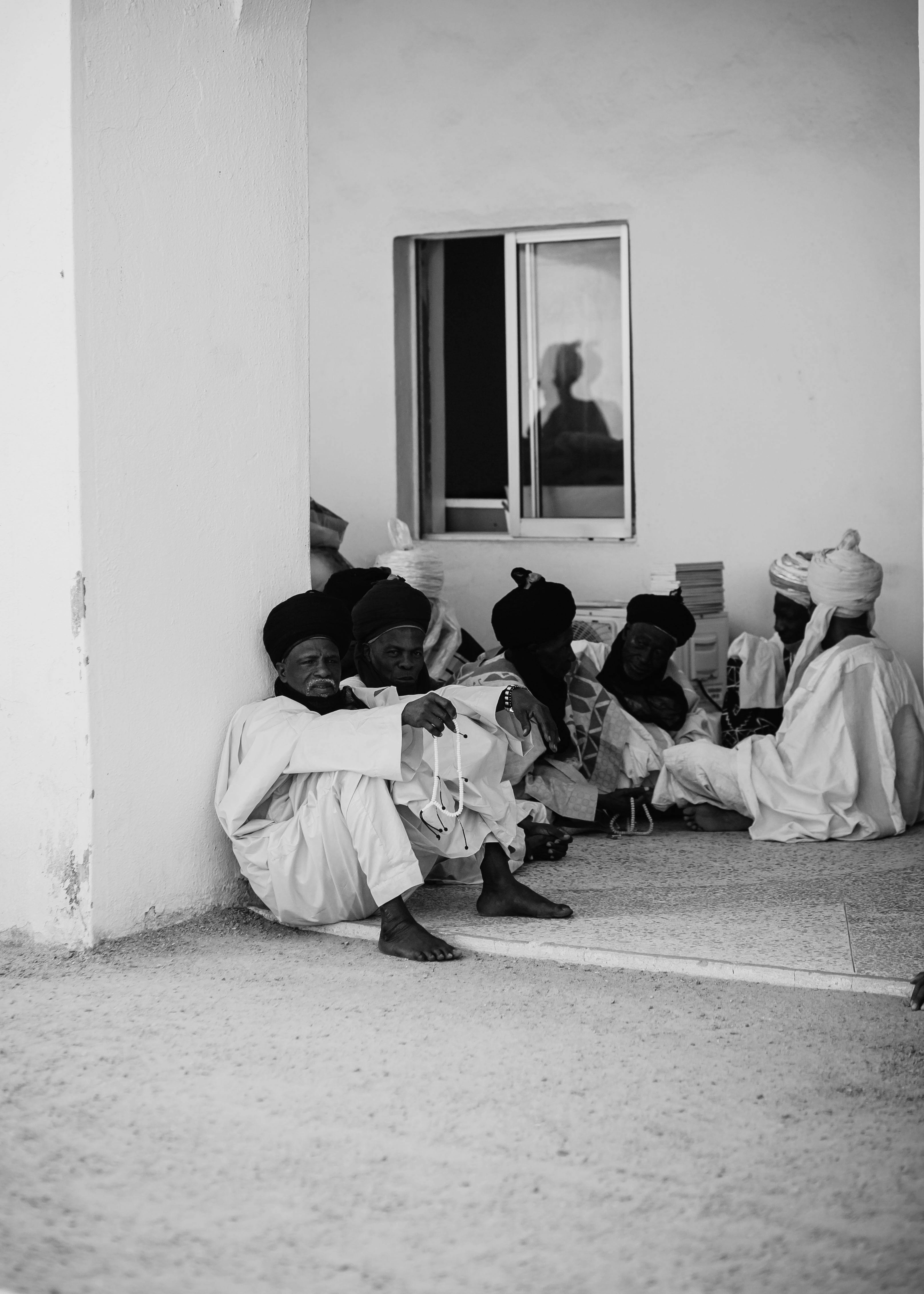 Relaxed Gathering of Men in Traditional Attire · Free Stock Photo