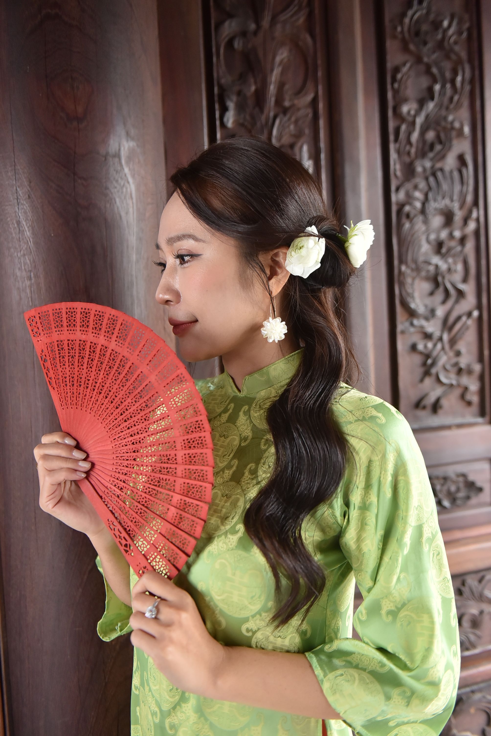Elegant Woman in Traditional Dress with Fan · Free Stock Photo