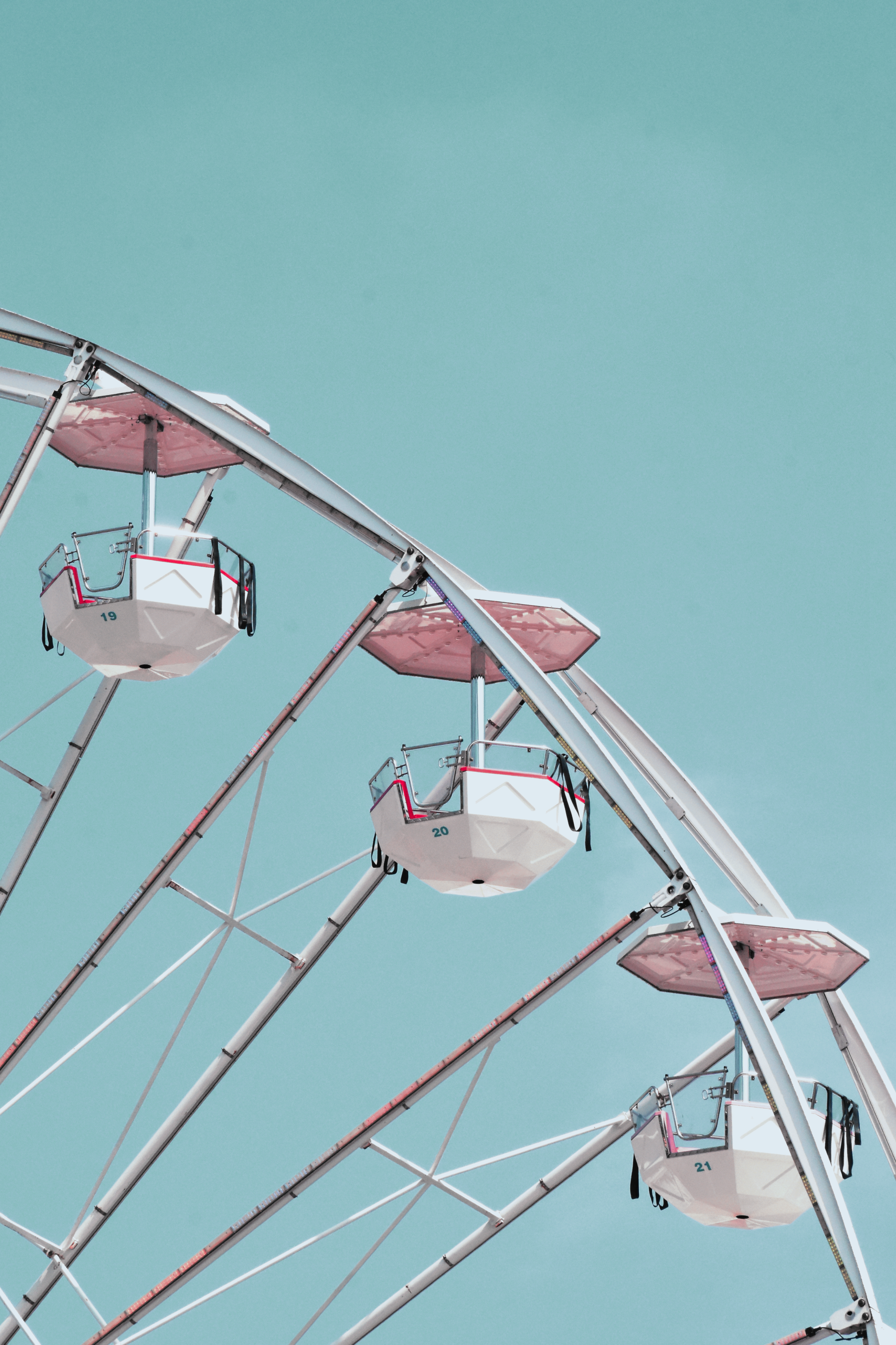 Pastel Ferris Wheel Against Blue Sky · Free Stock Photo