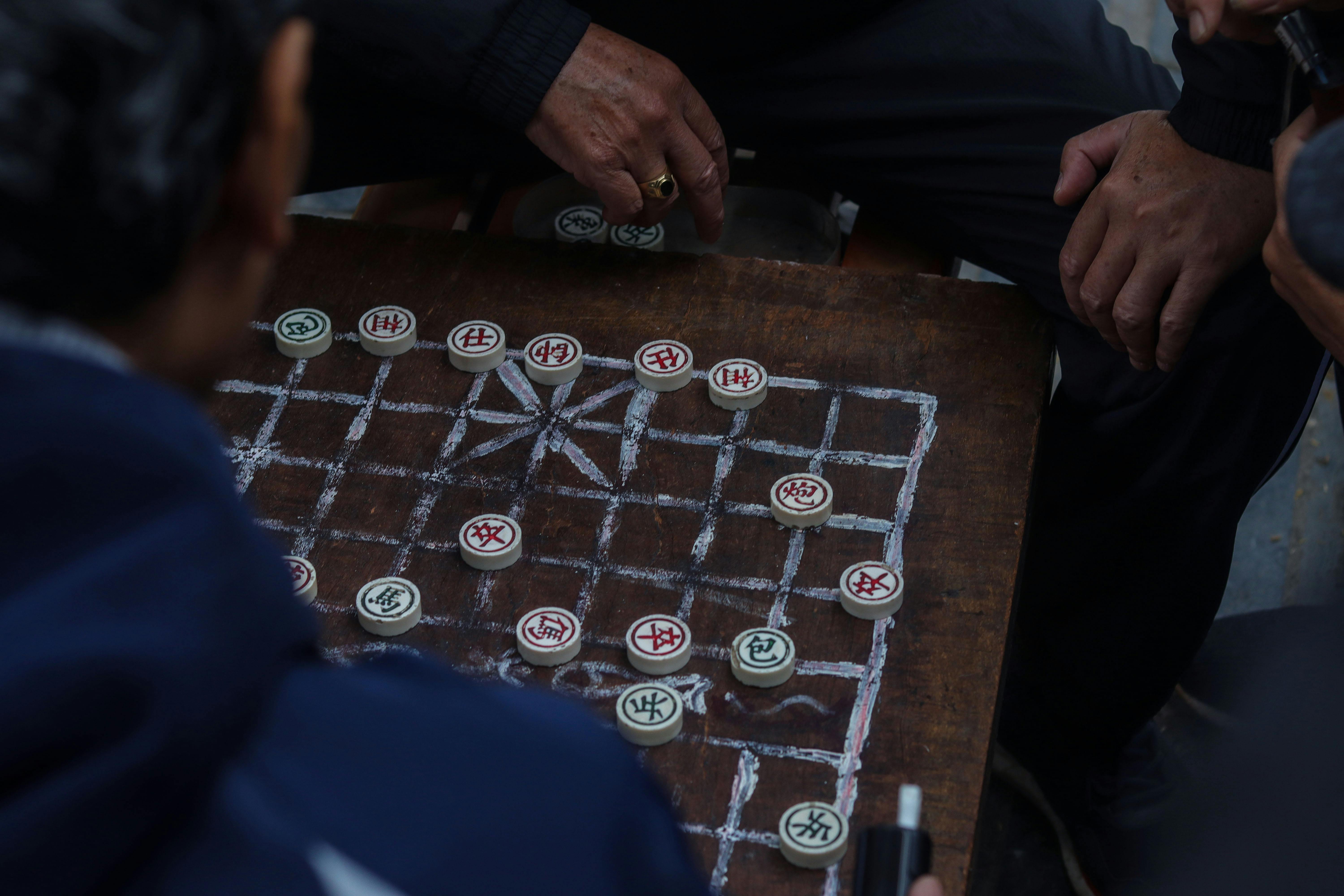 Engaged Players in a Traditional Xiangqi Game · Free Stock Photo