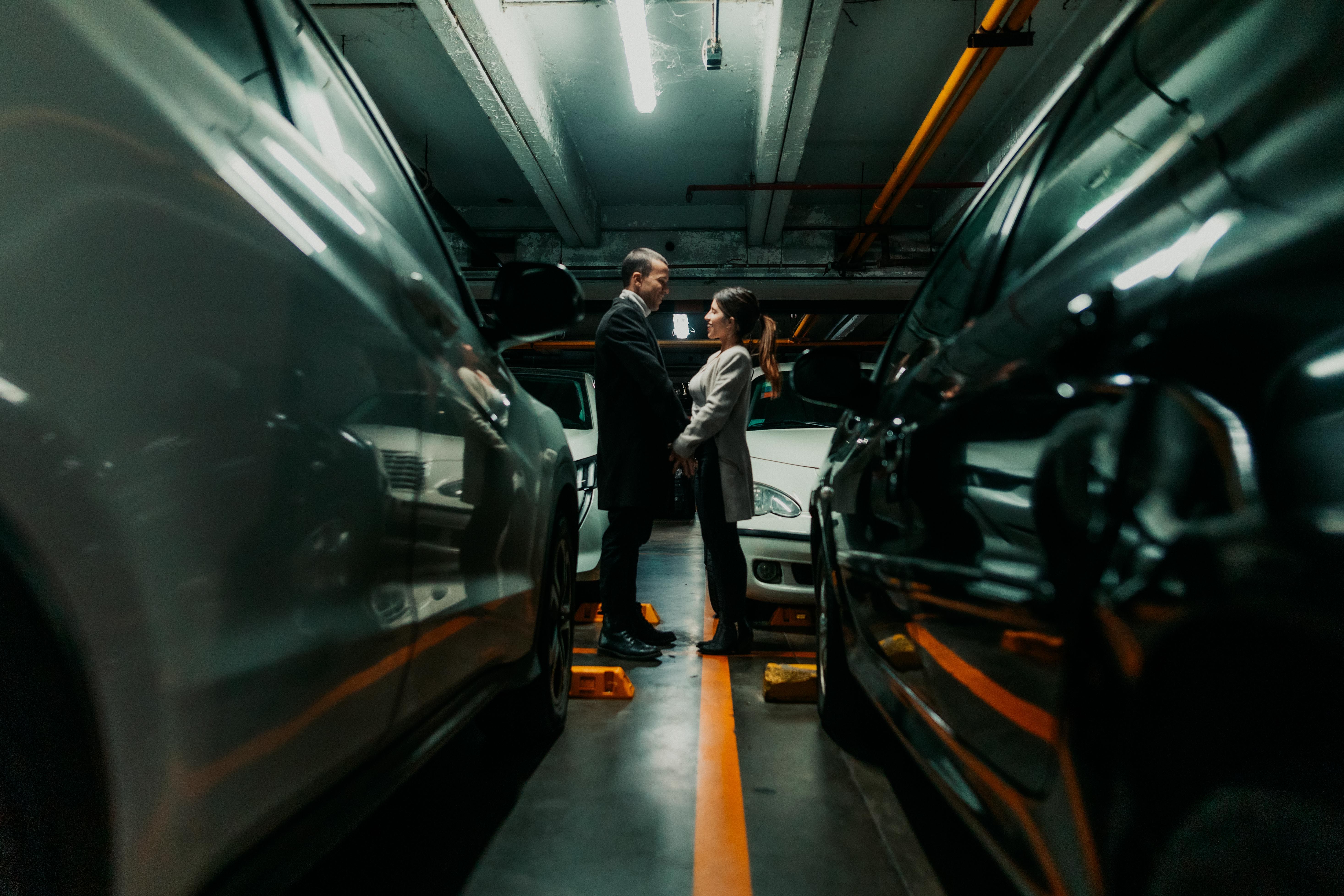 Intimate Urban Moment in Parking Garage · Free Stock Photo