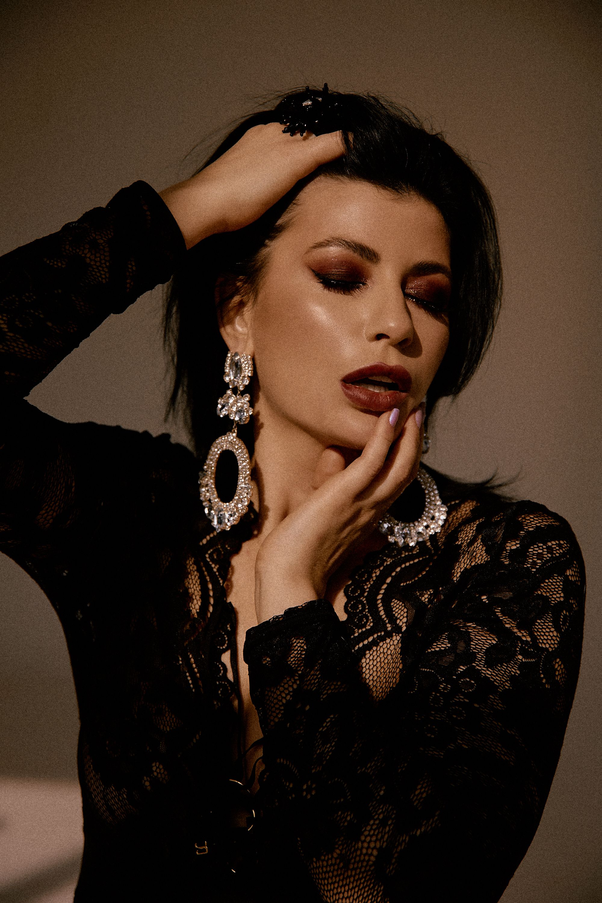 Elegant Woman in Black Lace with Dramatic Makeup · Free Stock Photo