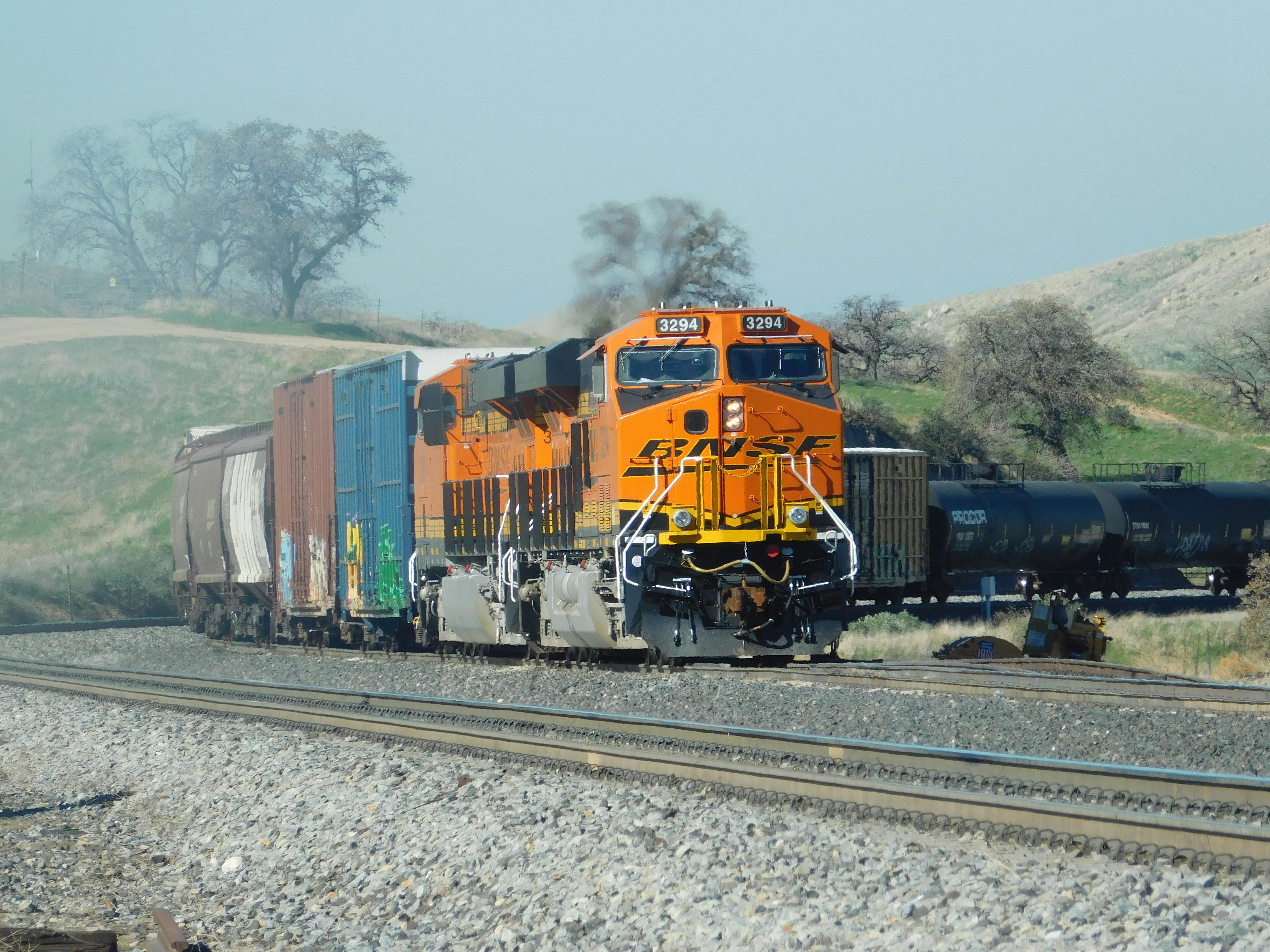 Freight Train on Rural Tracks in California · Free Stock Photo