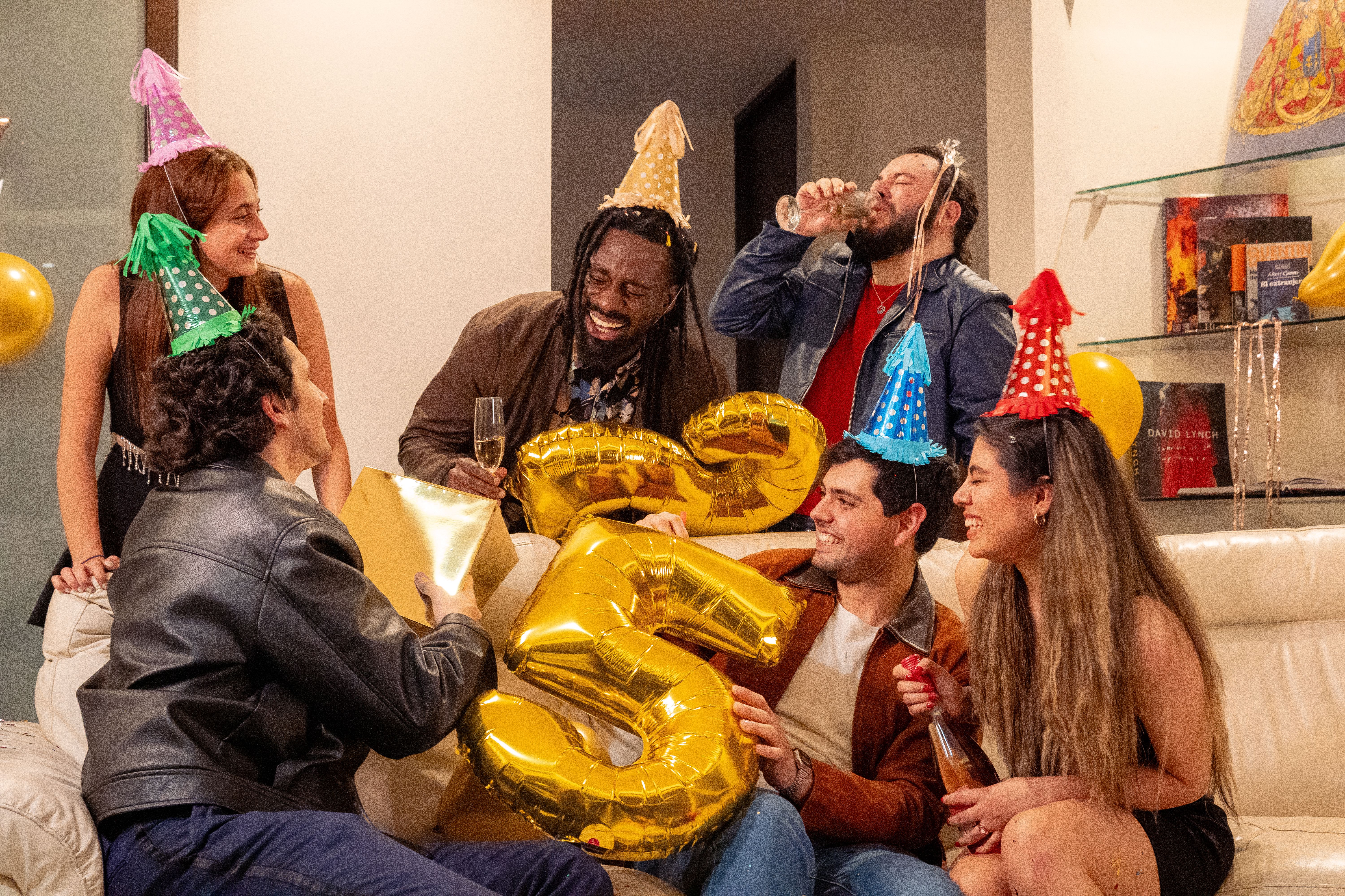 Lively Birthday Celebration with Friends Indoors · Free Stock Photo