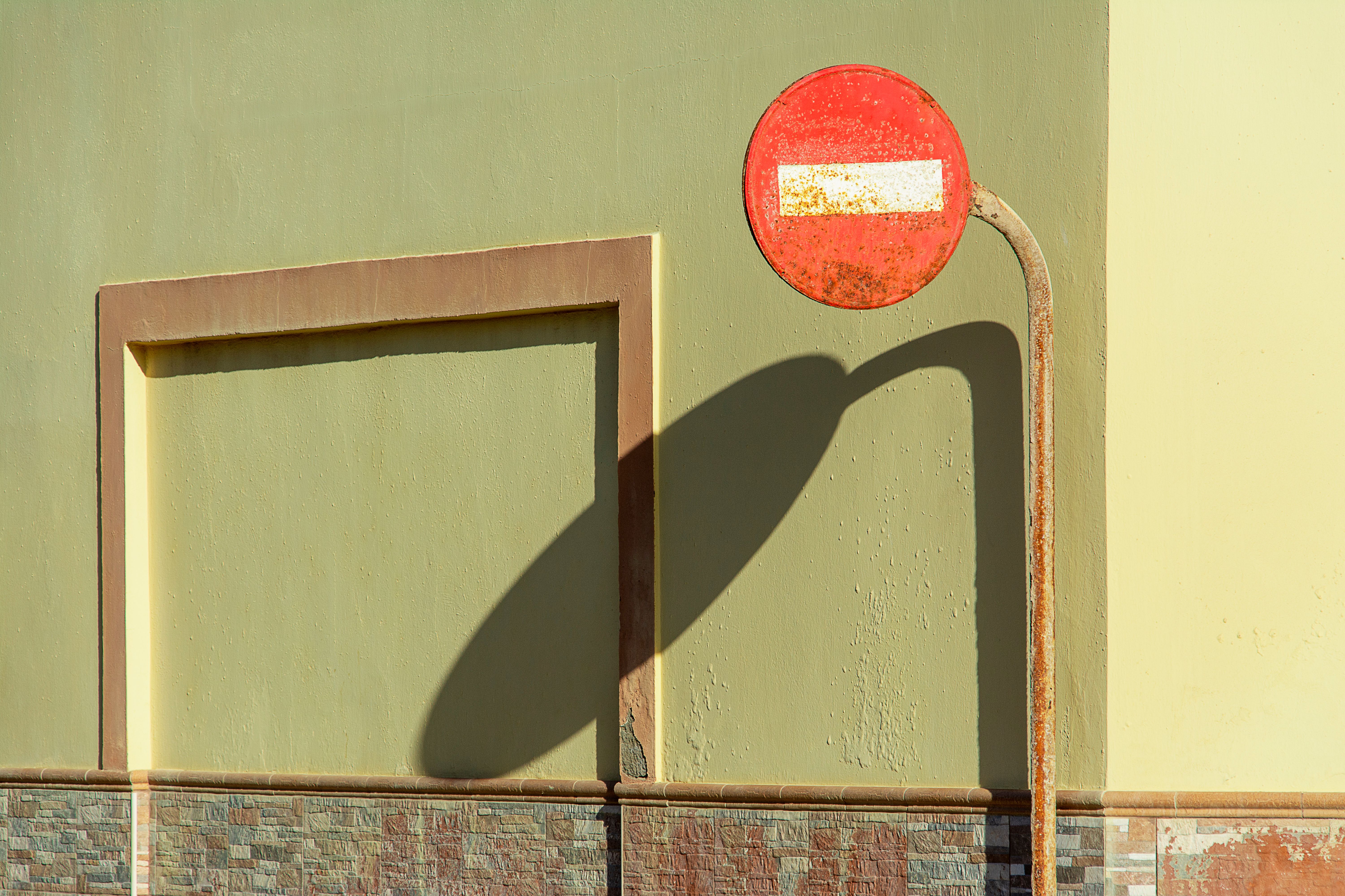 Rustic No Entry Sign with Bold Shadow · Free Stock Photo