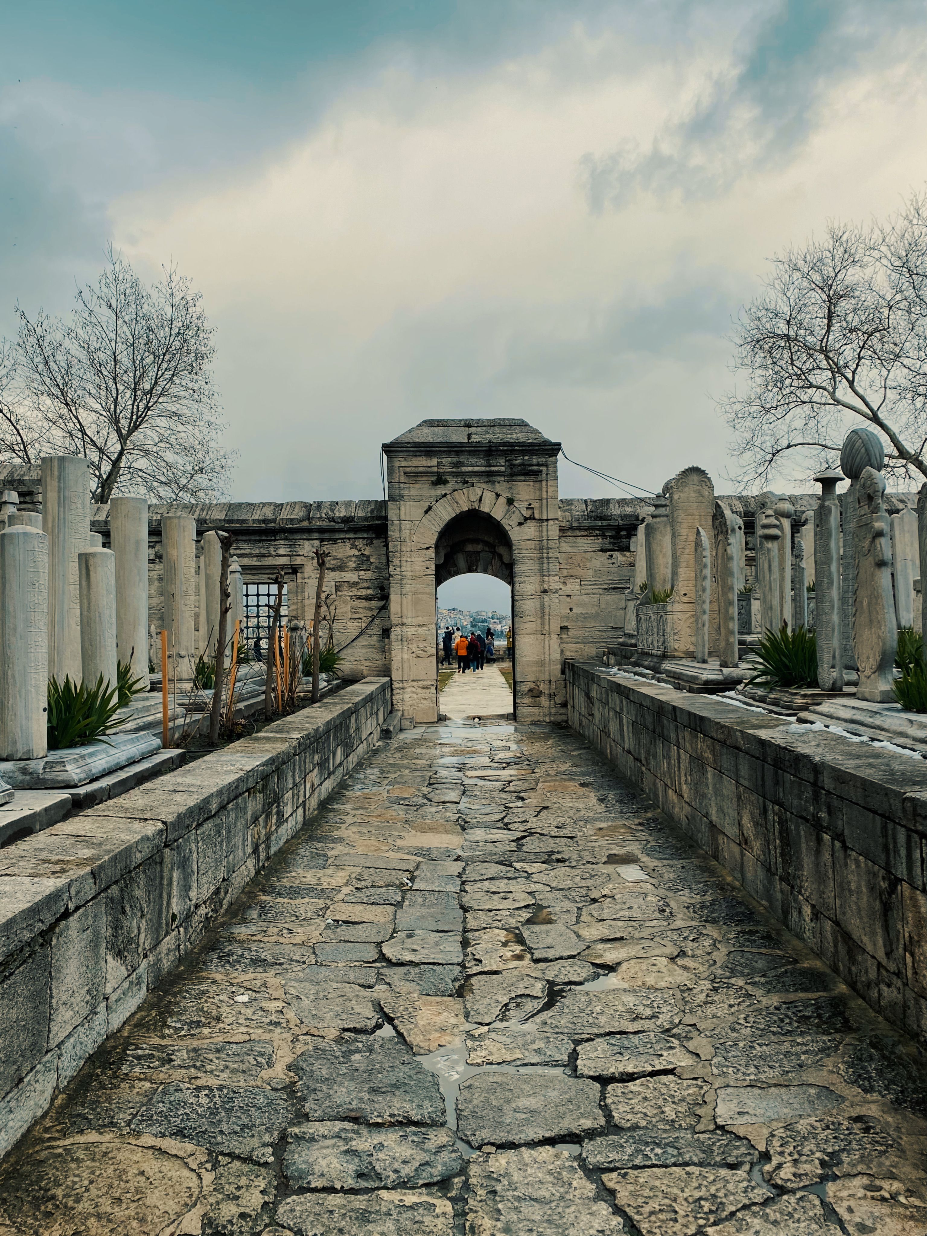 Ancient Stone Pathway Leading to Historical Archway · Free Stock Photo