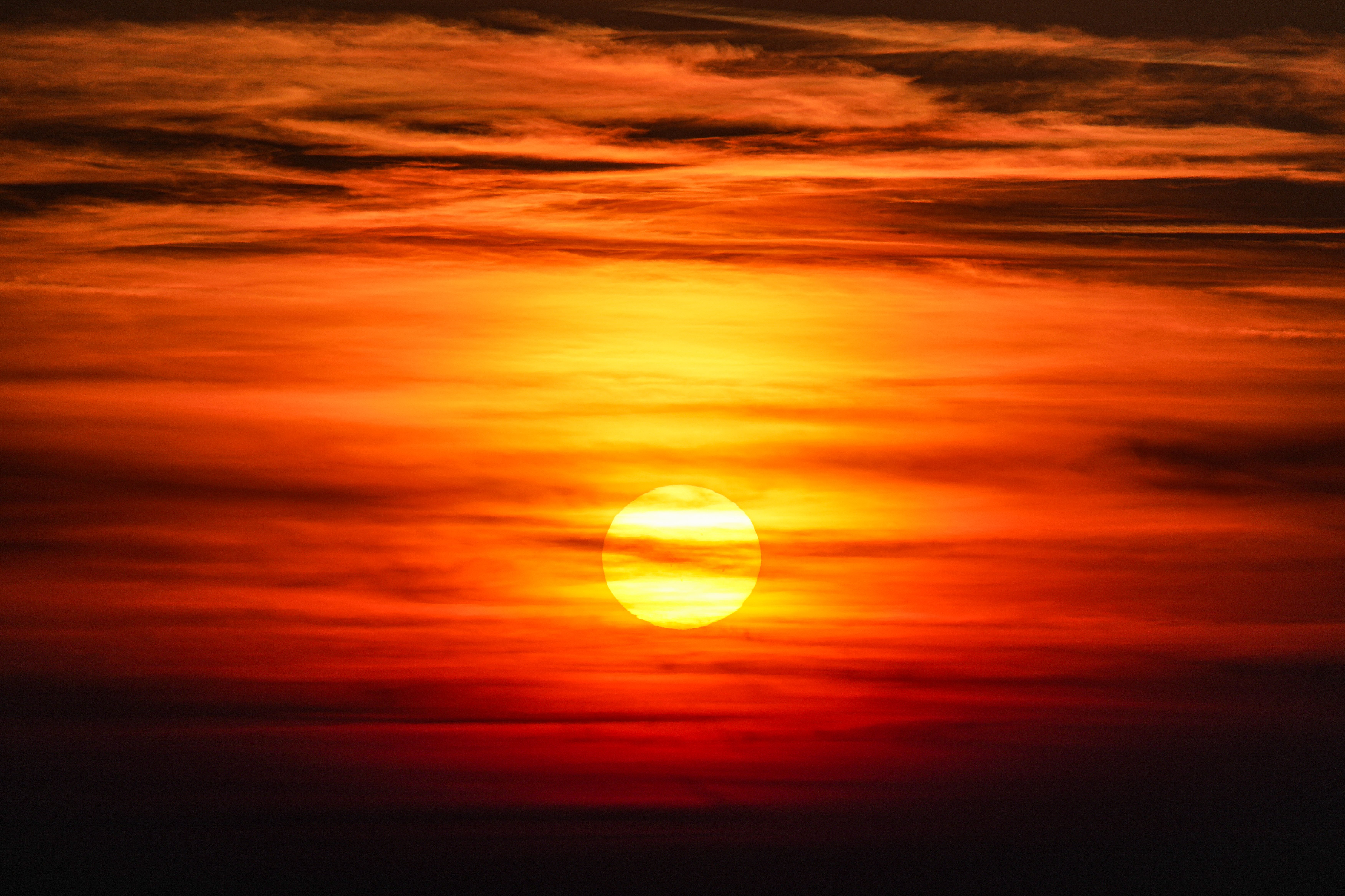 Dramatic Sunset with Vibrant Orange Sky · Free Stock Photo