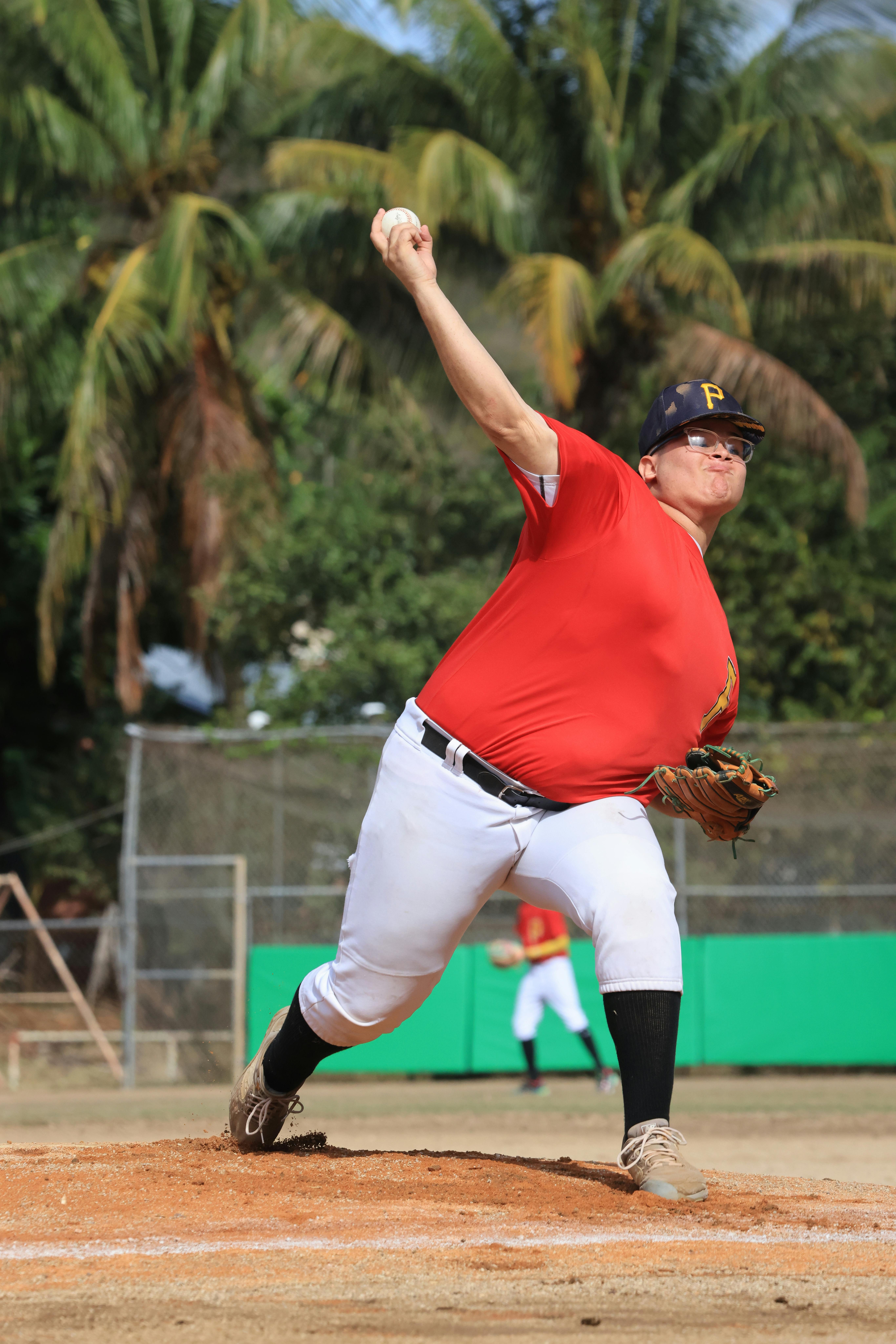 Baseball Pitcher in Action on Sunny Day · Free Stock Photo