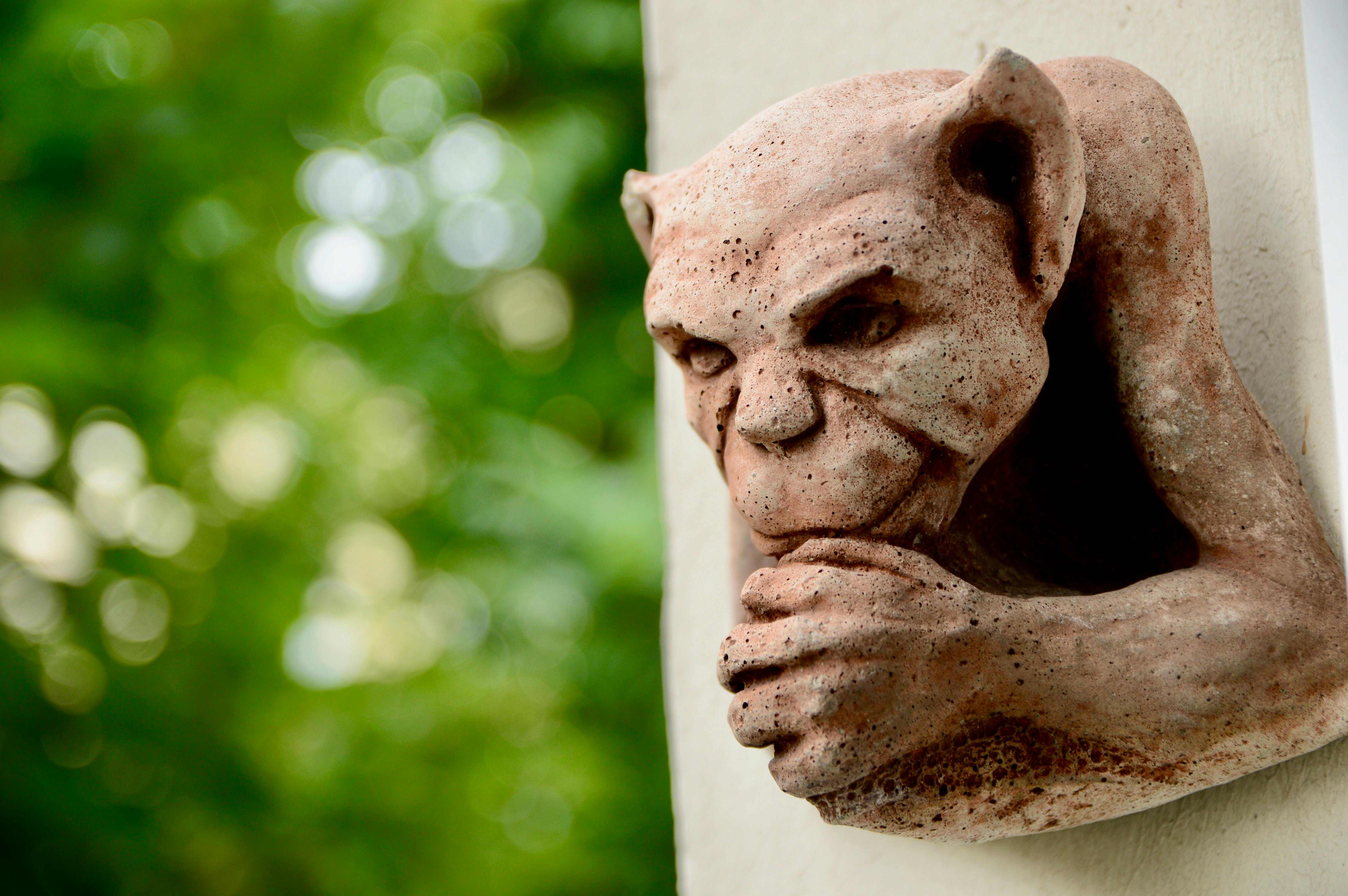 Stone Gargoyle Sculpture on Exterior Wall · Free Stock Photo