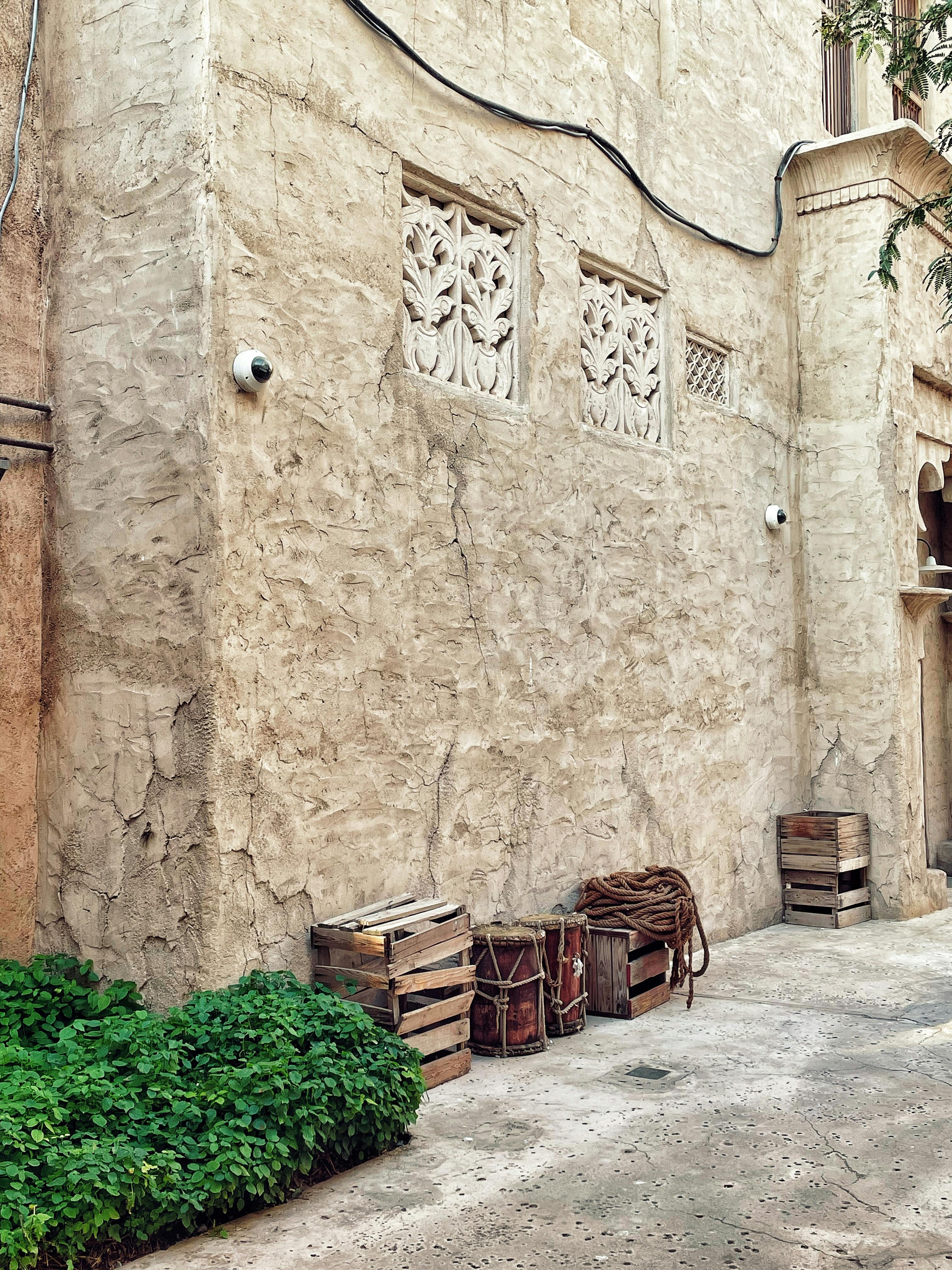 Historic Rustic Alley with Wooden Crates · Free Stock Photo