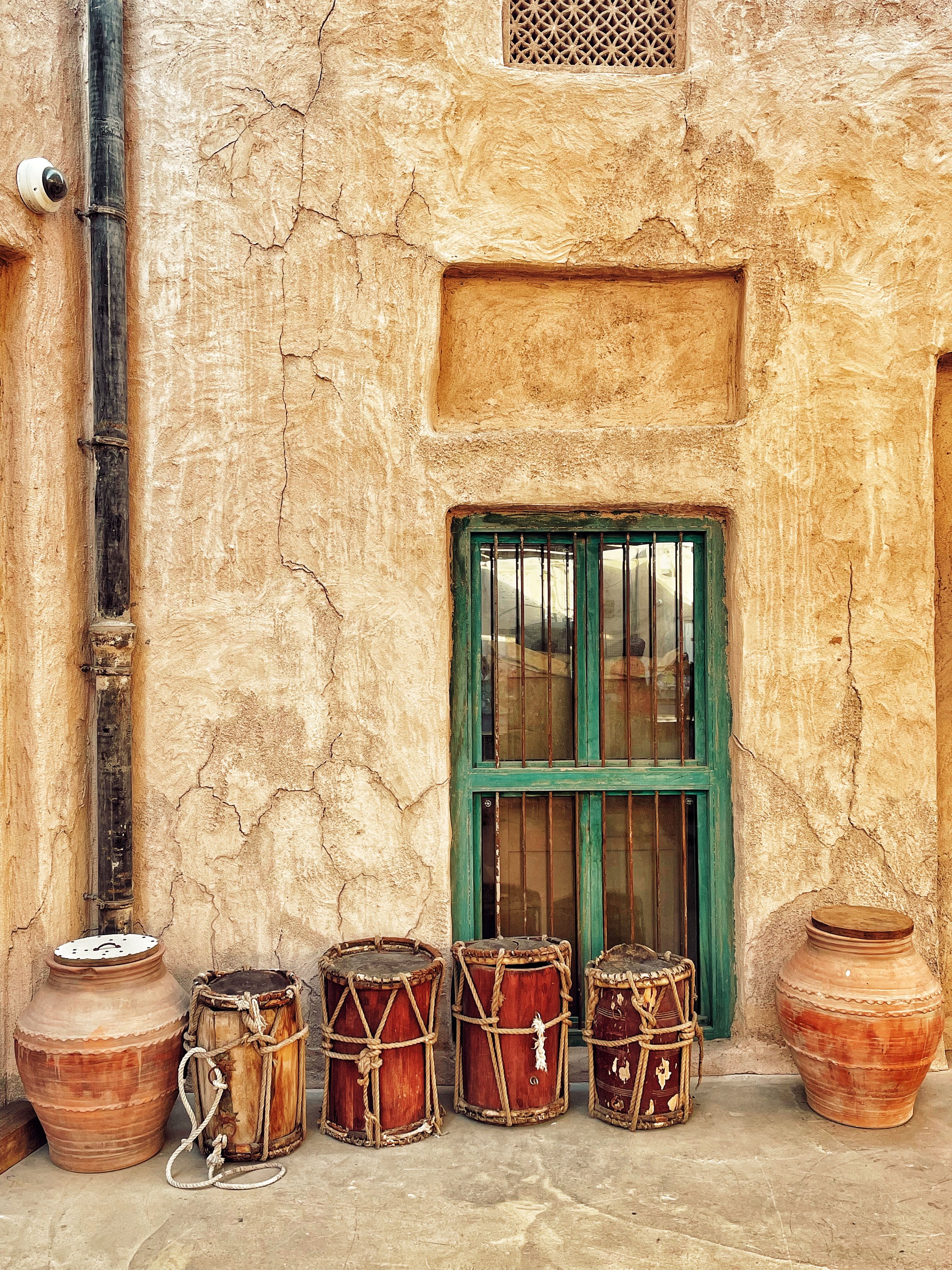 Traditional Drums and Pots by Rustic Window · Free Stock Photo