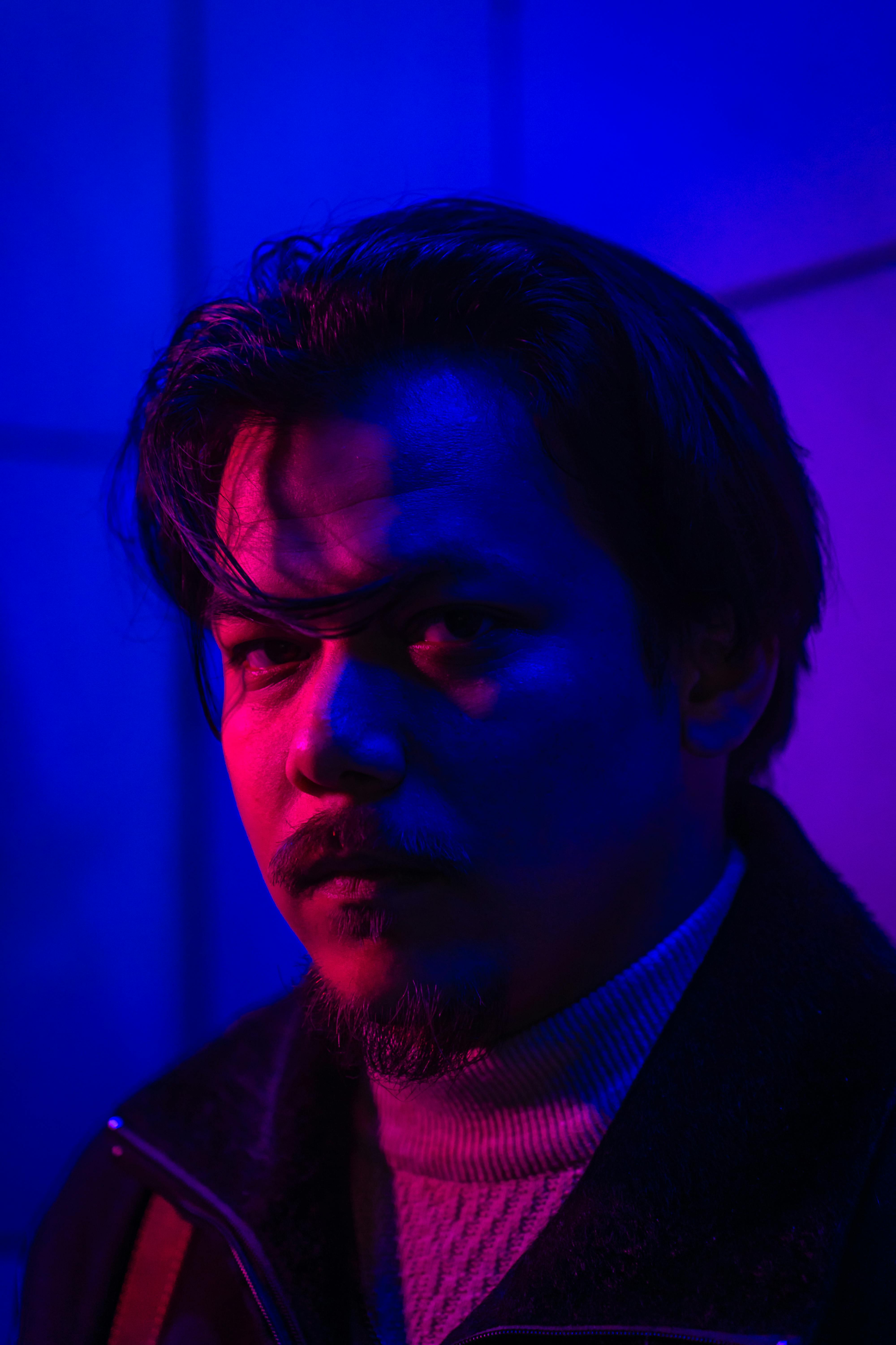 Moody Portrait in Dramatic Colored Lighting · Free Stock Photo