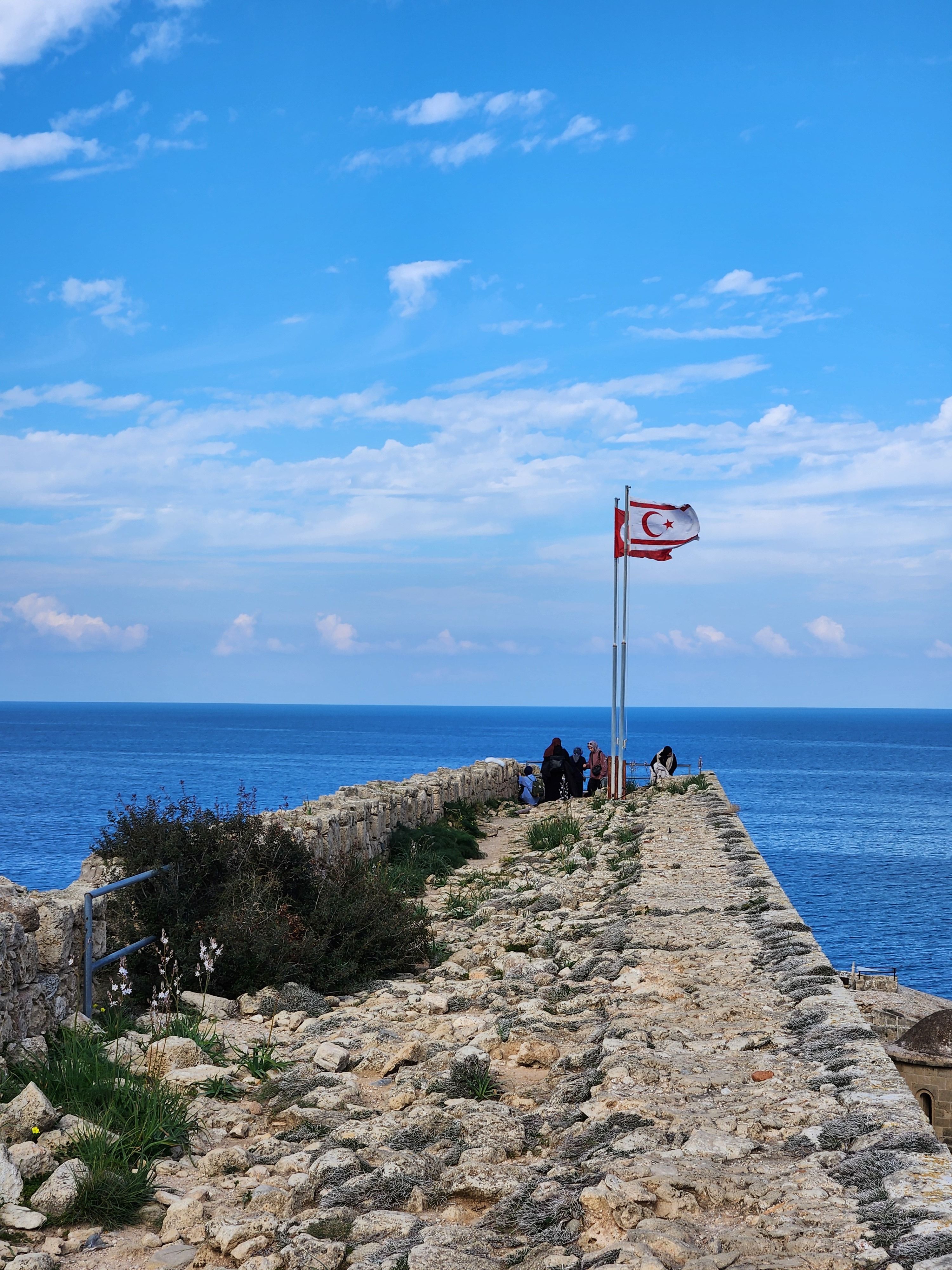 Scenic View of Kyrenia Castle with Flags and Sea · Free Stock Photo