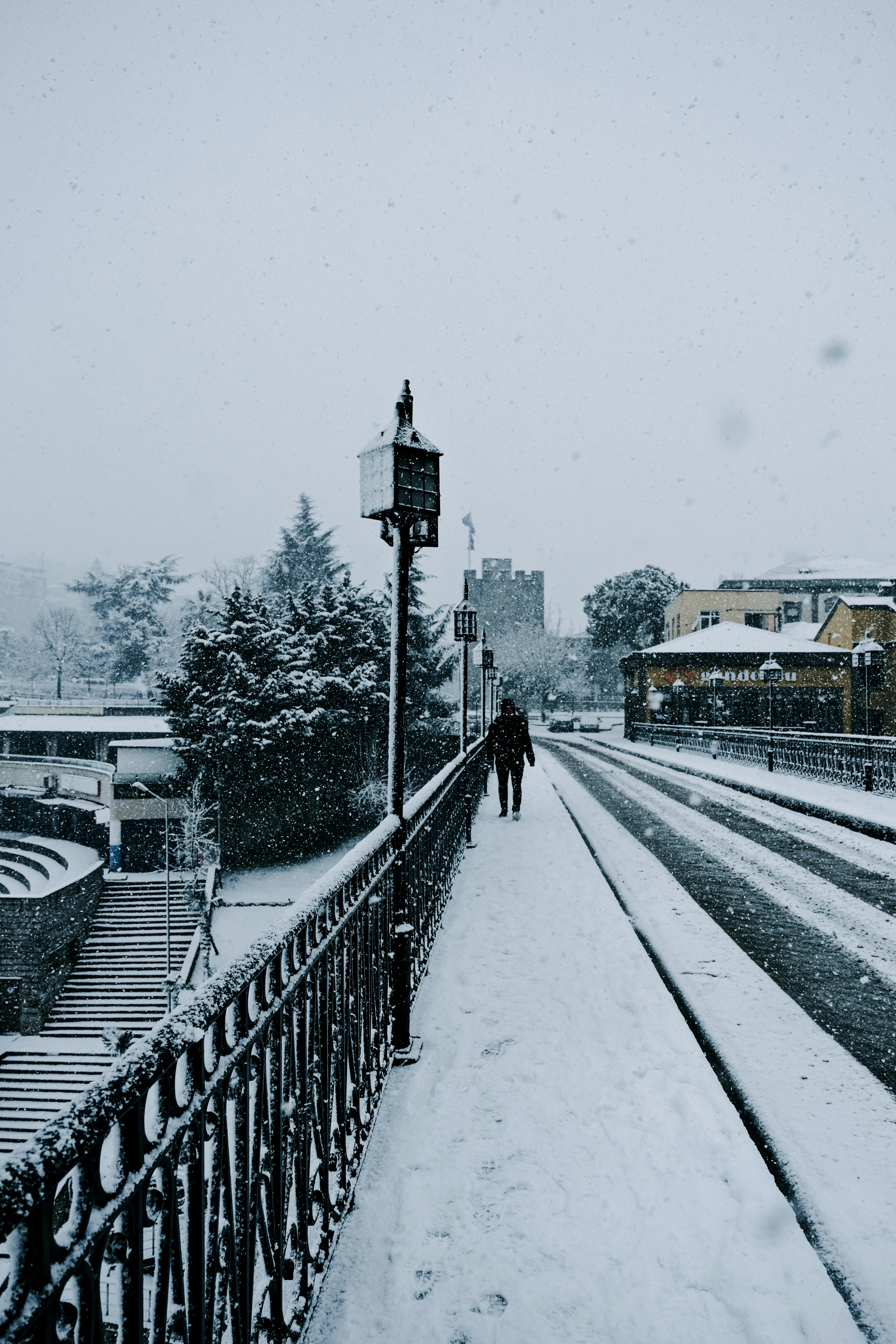 Man Walking in Snowy Trabzon Winter Street · Free Stock Photo
