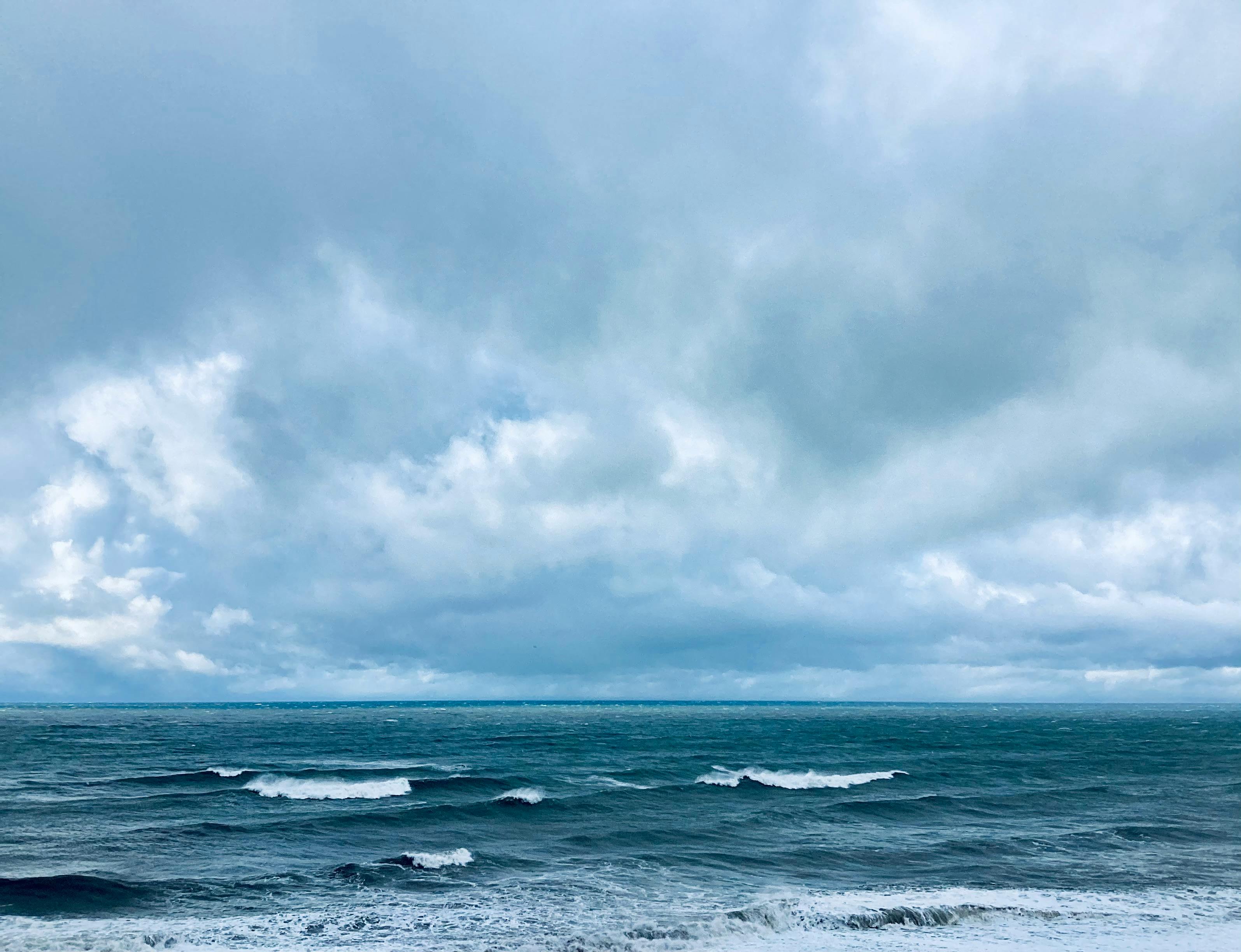 Dramatic Ocean Waves Under Overcast Sky · Free Stock Photo