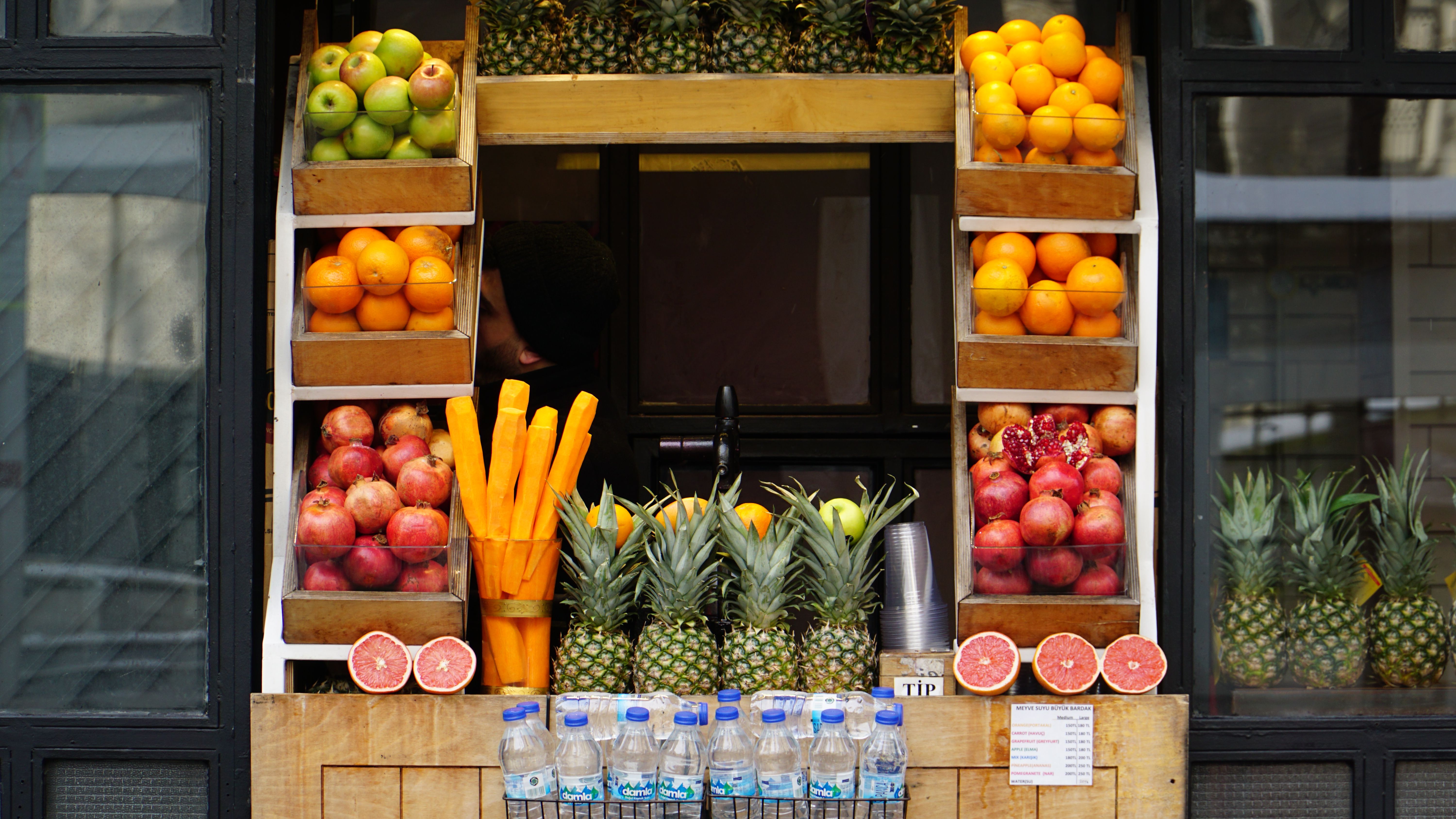 Colorful street fruit stand showcasing fresh produce · Free Stock Photo