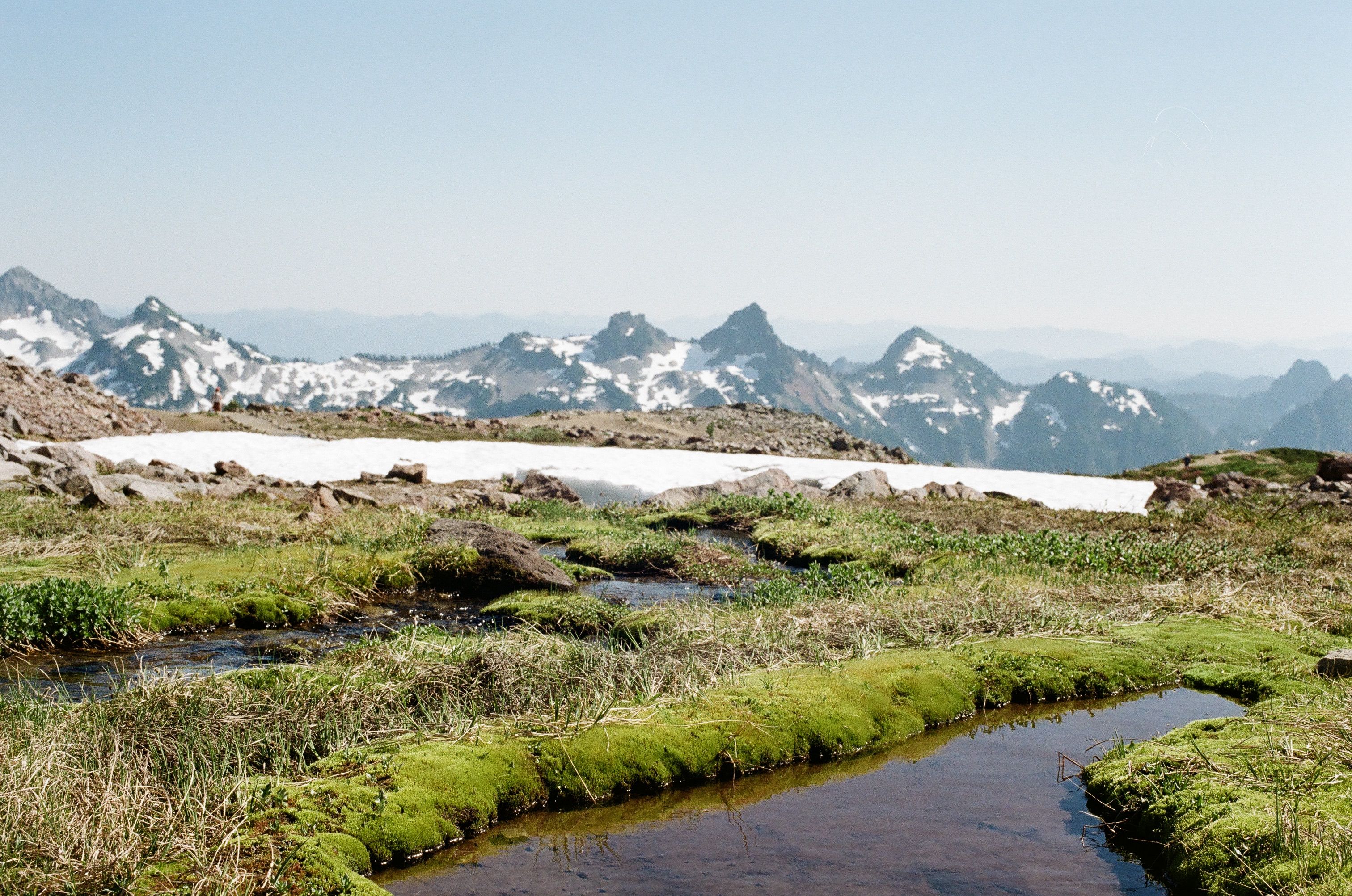 Serene Mountain Landscape with Snow and Greenery · Free Stock Photo