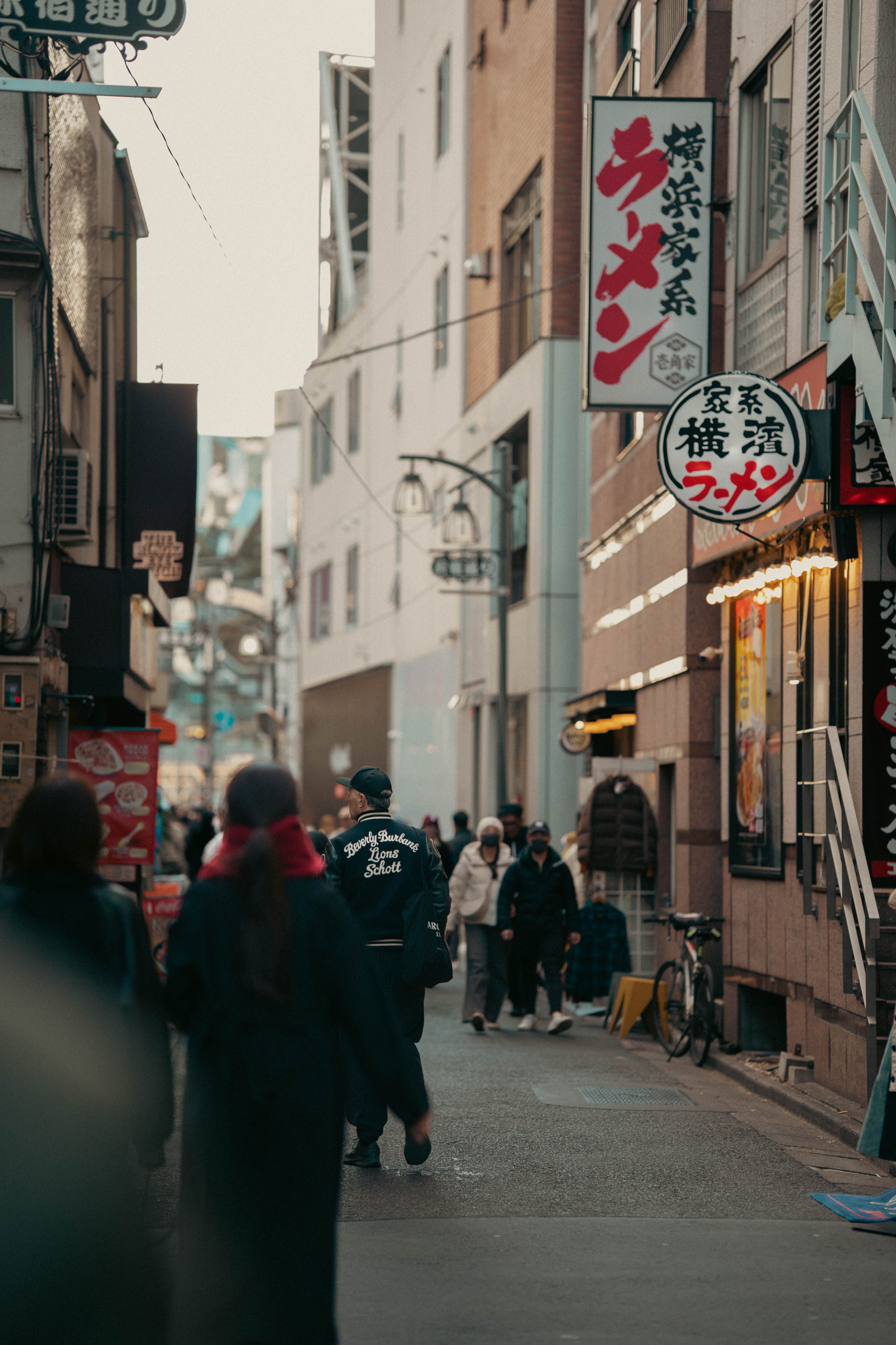 Bustling Street Scene in Urban Japan with Neon Lights · Free Stock Photo