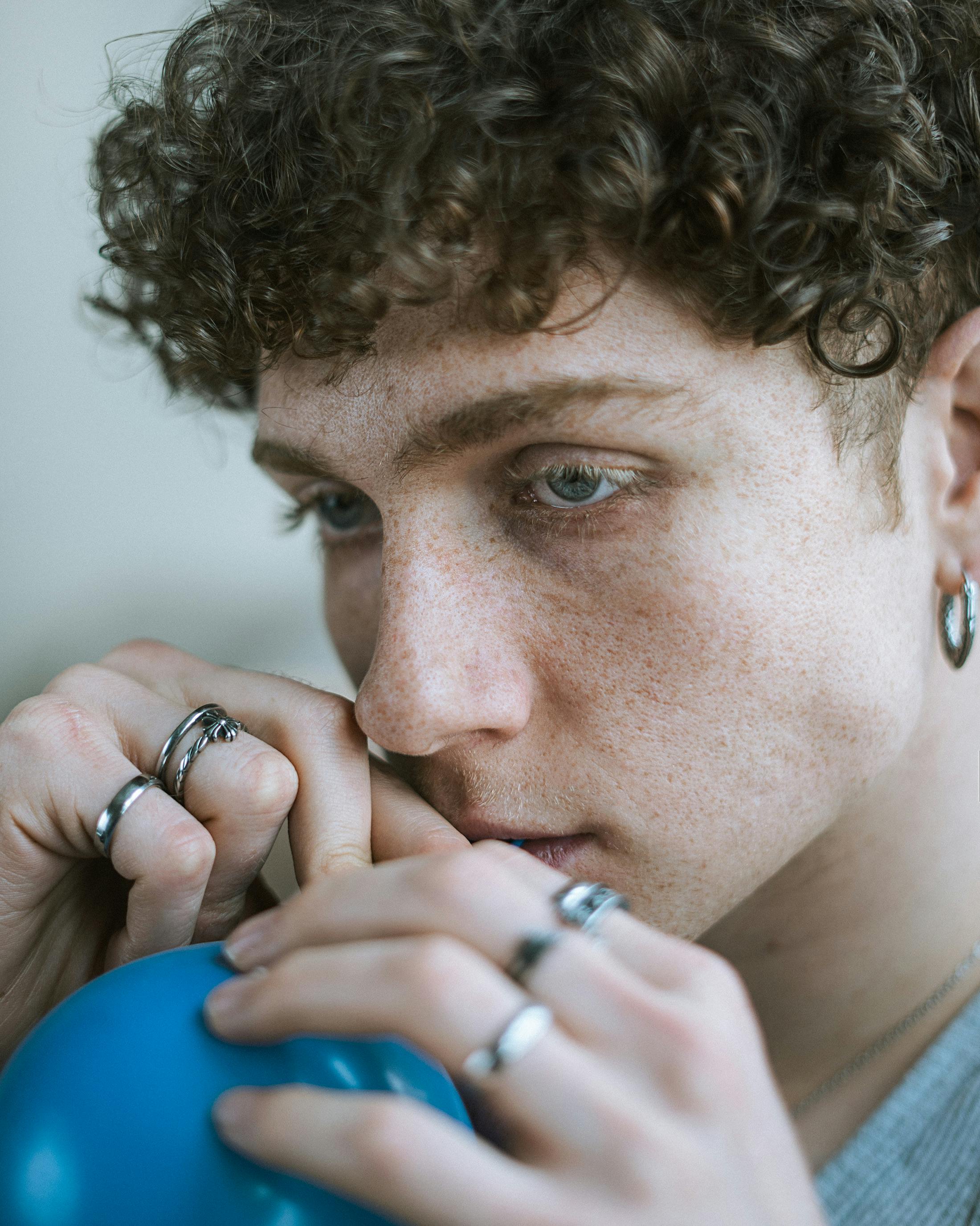 Close-up Portrait of Young Person with Rings · Free Stock Photo
