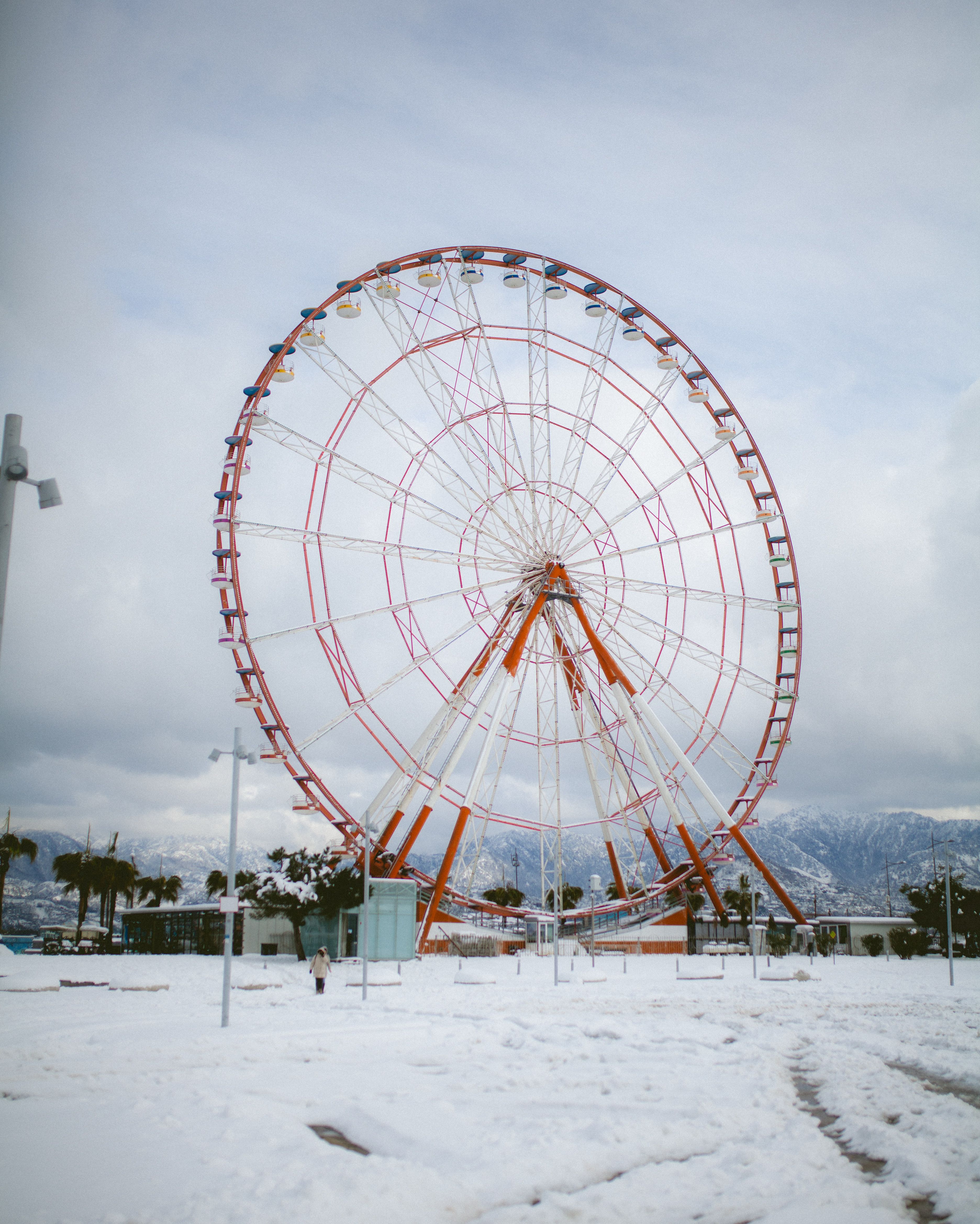 Giant Ferris Wheel in Snowy Winter Landscape · Free Stock Photo